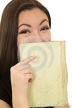 Young Student Laughing Behind A Book Covering Her Face Royalty-Free ...