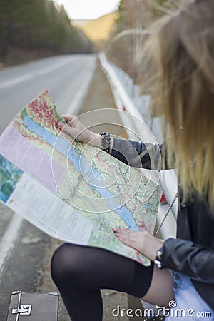 Young Traveler Looking At Maps Stock Image | CartoonDealer.com #71346535