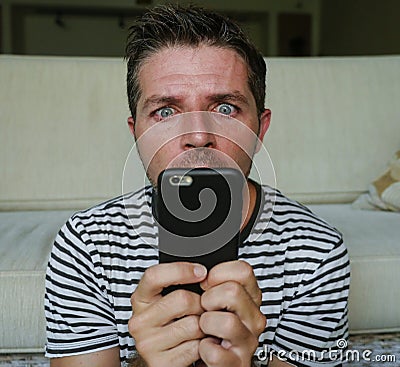 Young Weird And Crazy Mobile Phone Addict Man Using Cell Compulsively ...