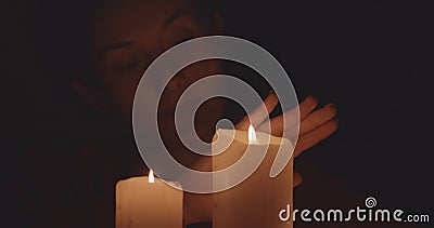 Young Woman Touching Candle`s Flame in Darkness Stock Video - Video of ...