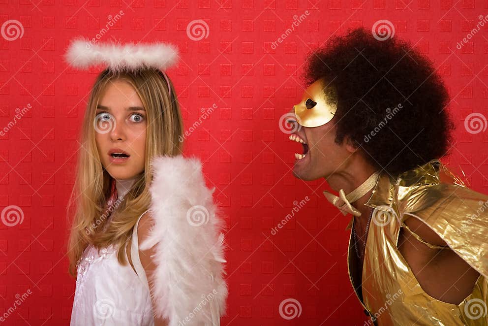 Ángel y diablo foto de archivo. Imagen de diablo, rivalidad - 6366444