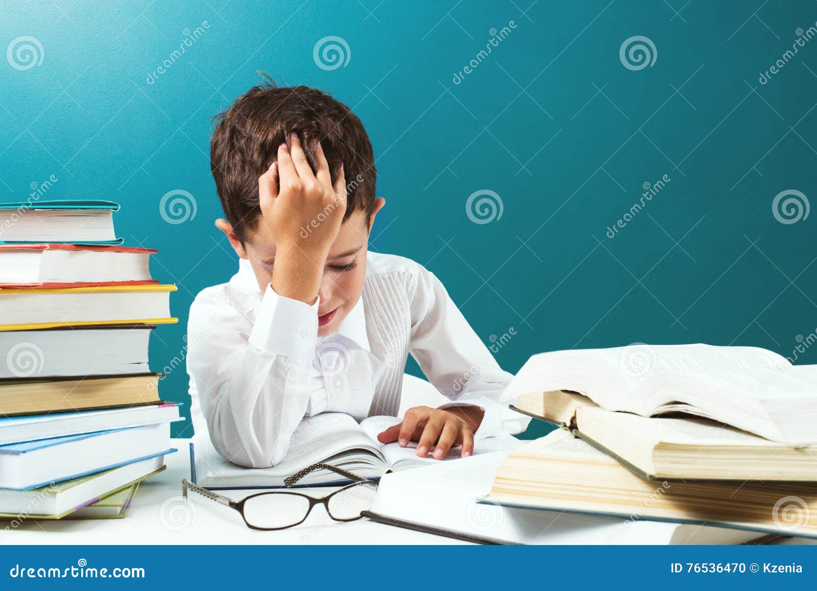 Ð¡ute Boy Reading Difficult Book at the Table, Blue Background Stock ...