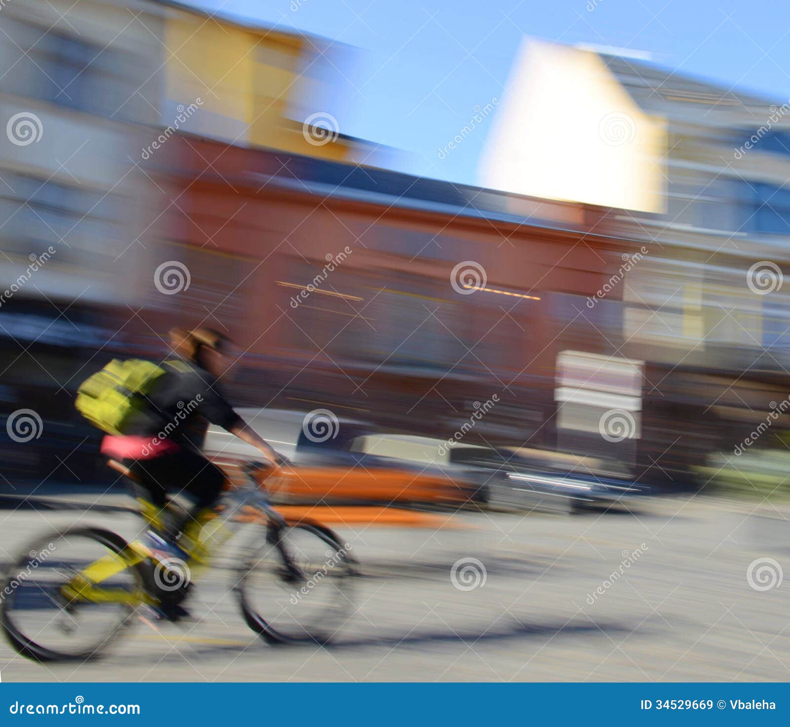 Ð¡yclist in Motion Going Down the Street Stock Image - Image of moving ...