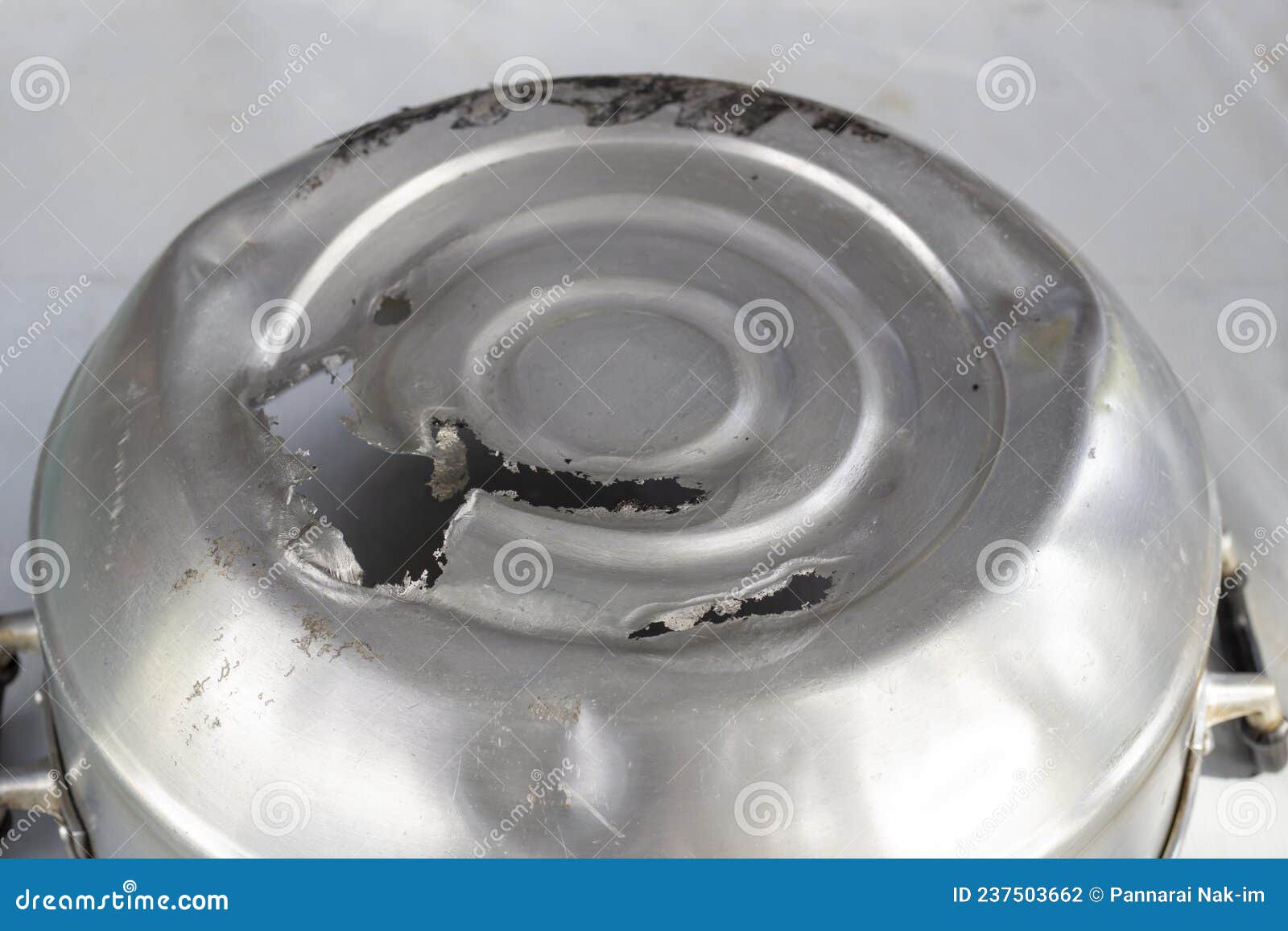 à¸ºBottom of the Burnt Pot until Perforated in the Kitchen. Stock Photo ...