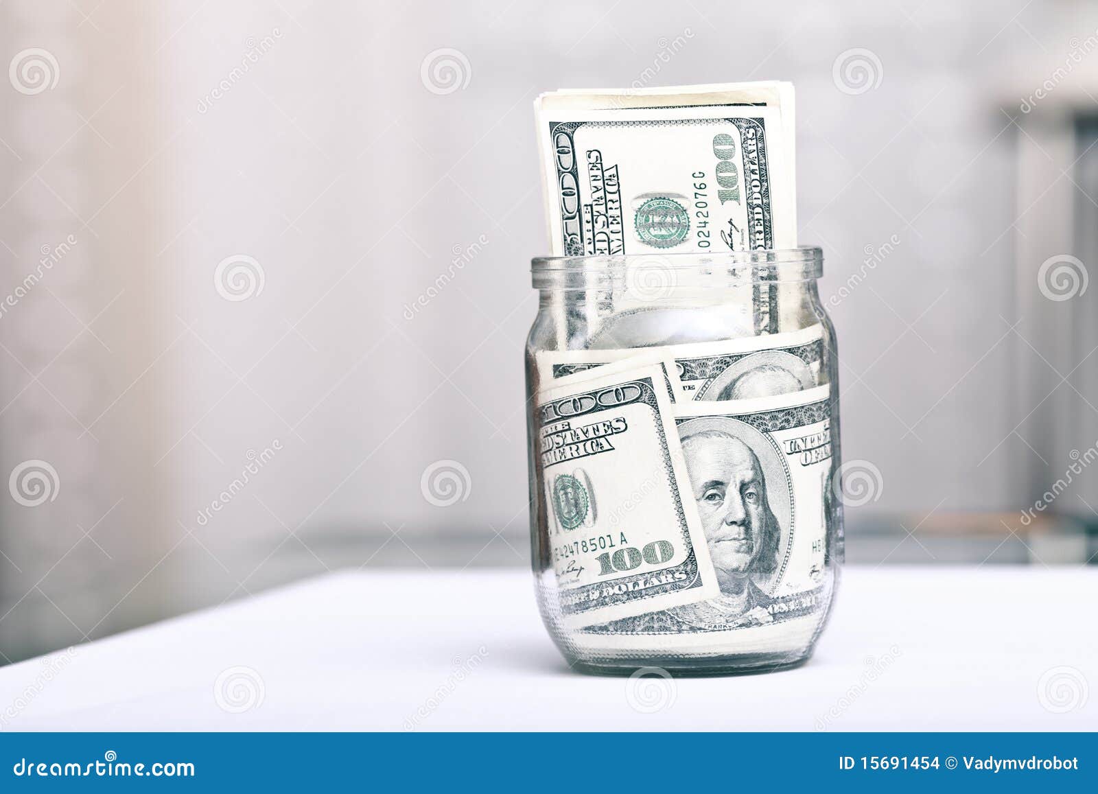 100 US Dollars Bank Notes in a Glass Jar Stock Photo - Image of pile ...