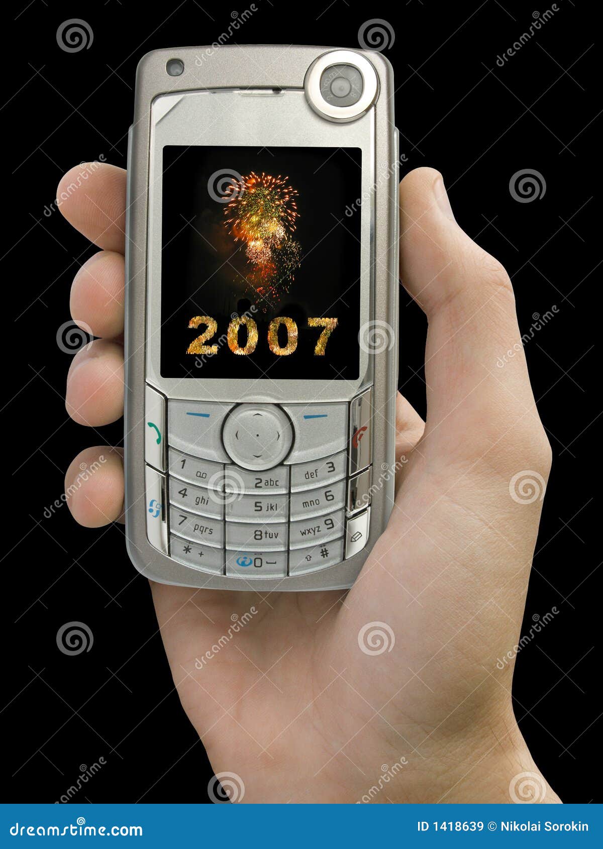2007 and Fireworks on Display of Mobile Phone in Hand Stock Image ...