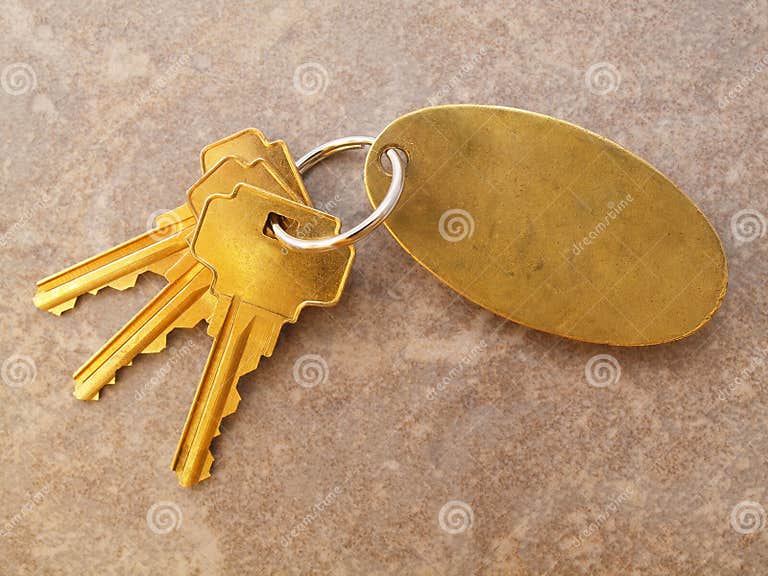 3 Gold Keys and Blank Keychain on Tile Stock Image - Image of open ...