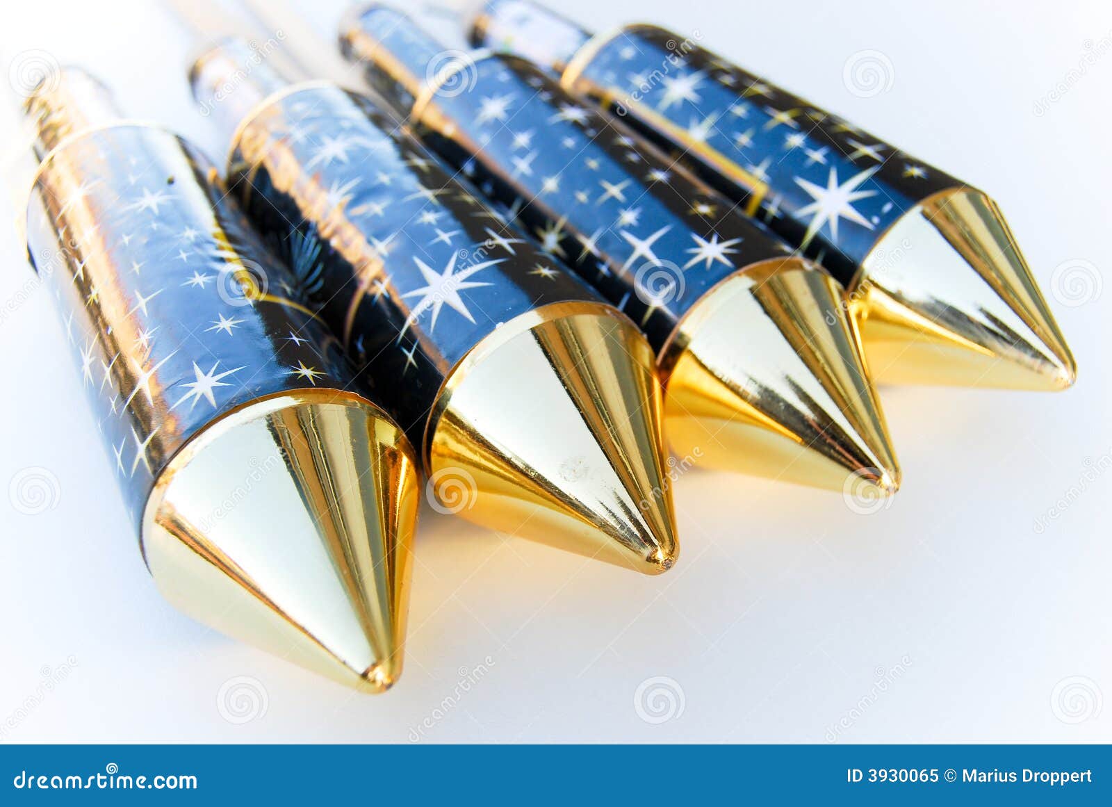 4 Diagonal New Fireworks Rockets with Golden Top Stock Image - Image of ...