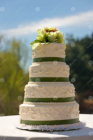 A 4 Tier Wedding Cake in a Garden Setting Stock Photo - Image of green ...
