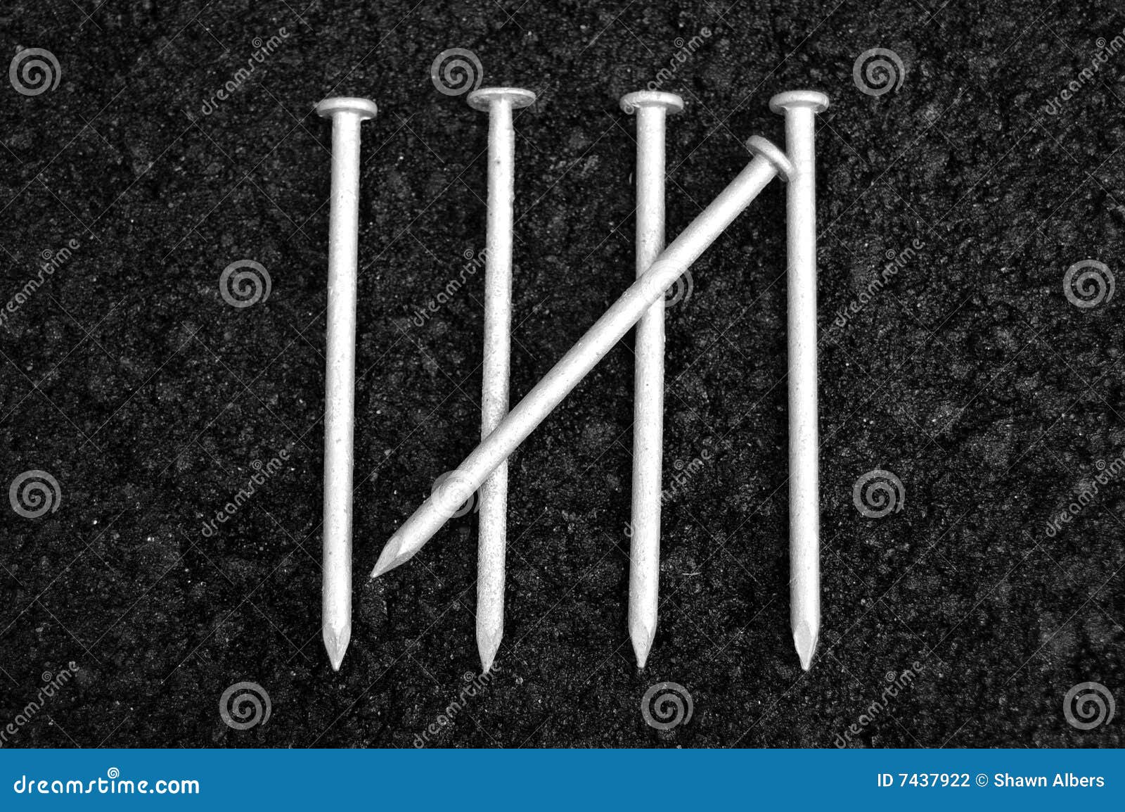 5 Nails on Asphalt stock photo. Image of counting, road - 7437922