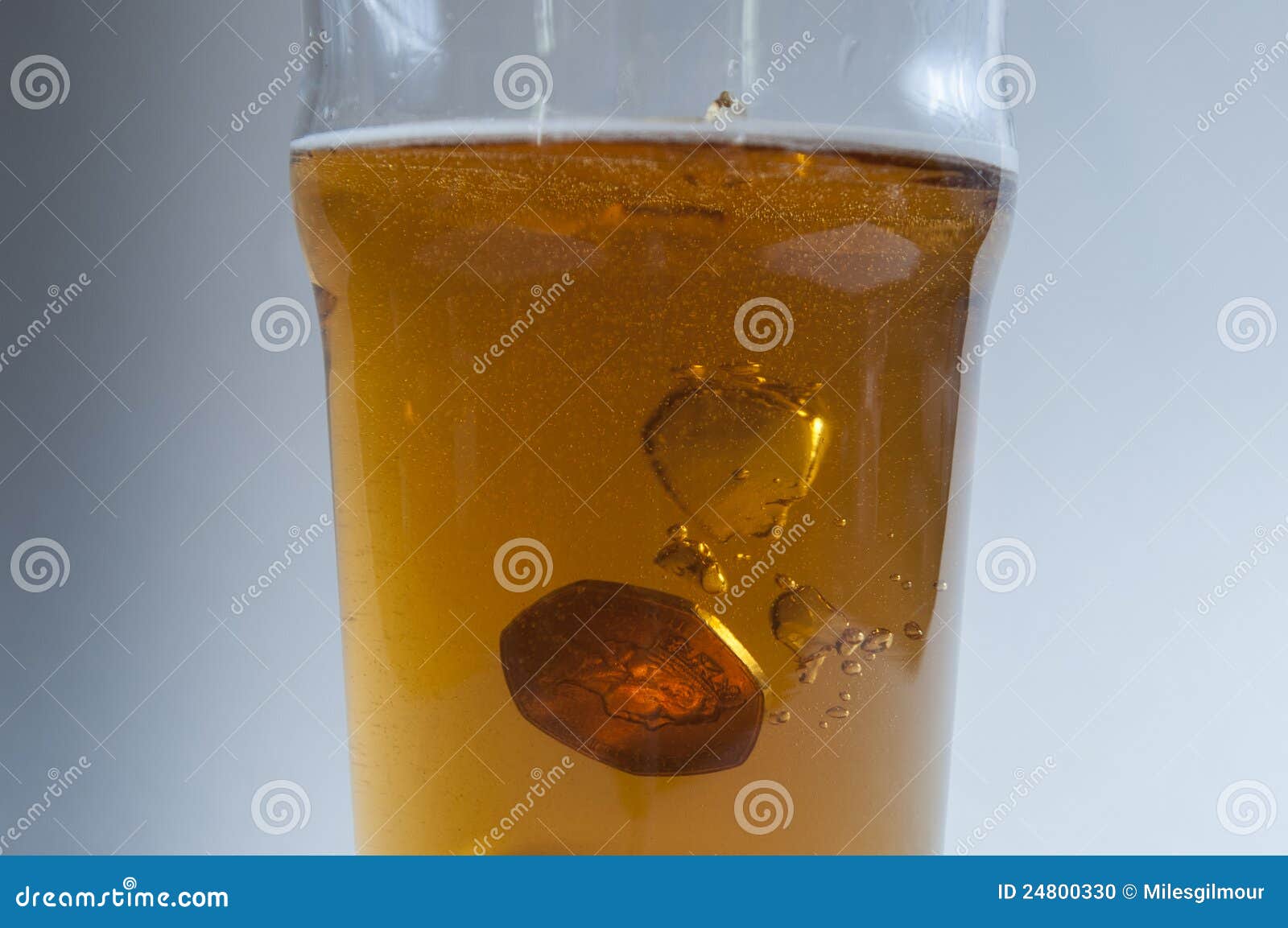50p Coin Dropping into a Pint of Beer Stock Photo - Image of pint ...