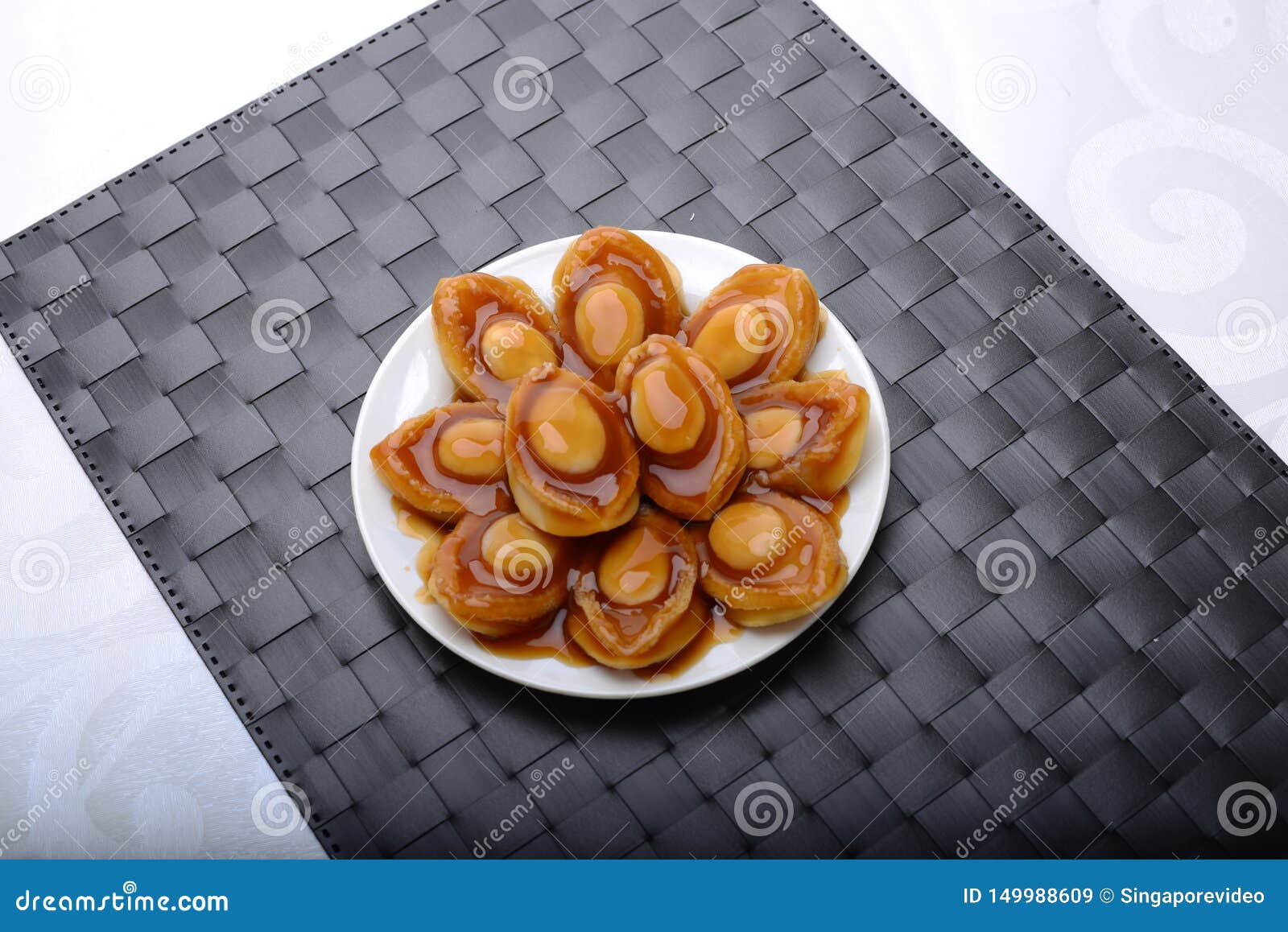 Abalone Servings in a Fine Dining Setting on Black Table Mat Stock ...