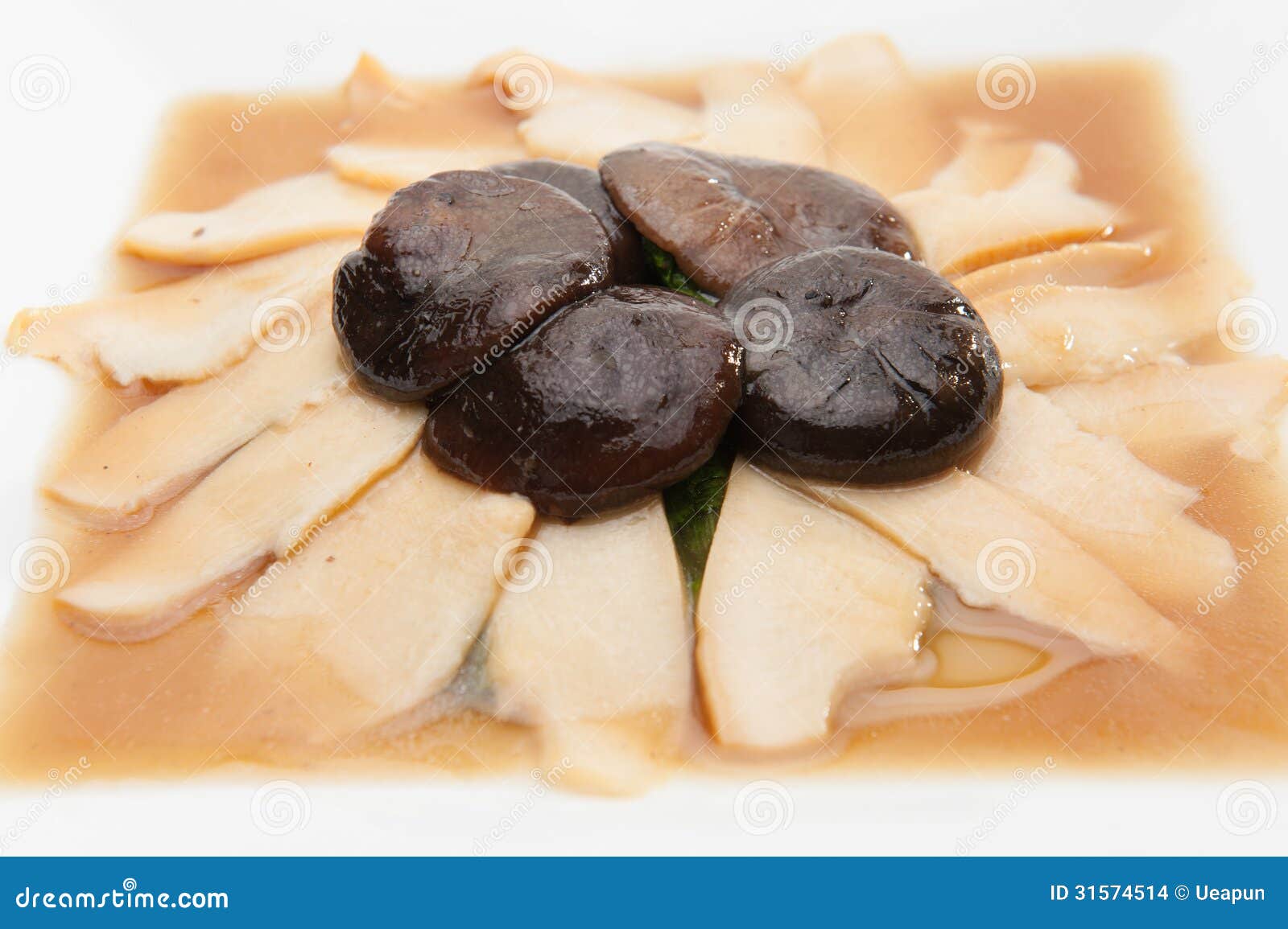 Abalone Slices in Red Sauce Stock Photo - Image of aromatic, petite ...