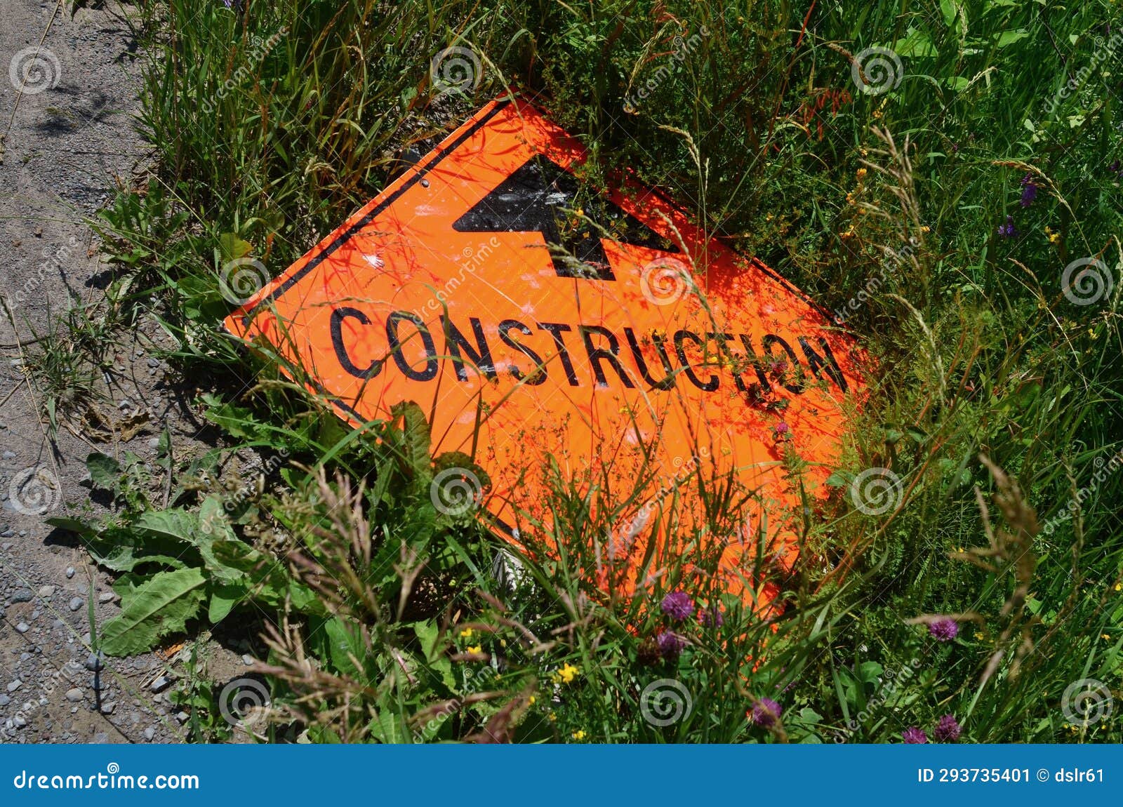Abandonded Construction Sign in the Grass Stock Image - Image of ...