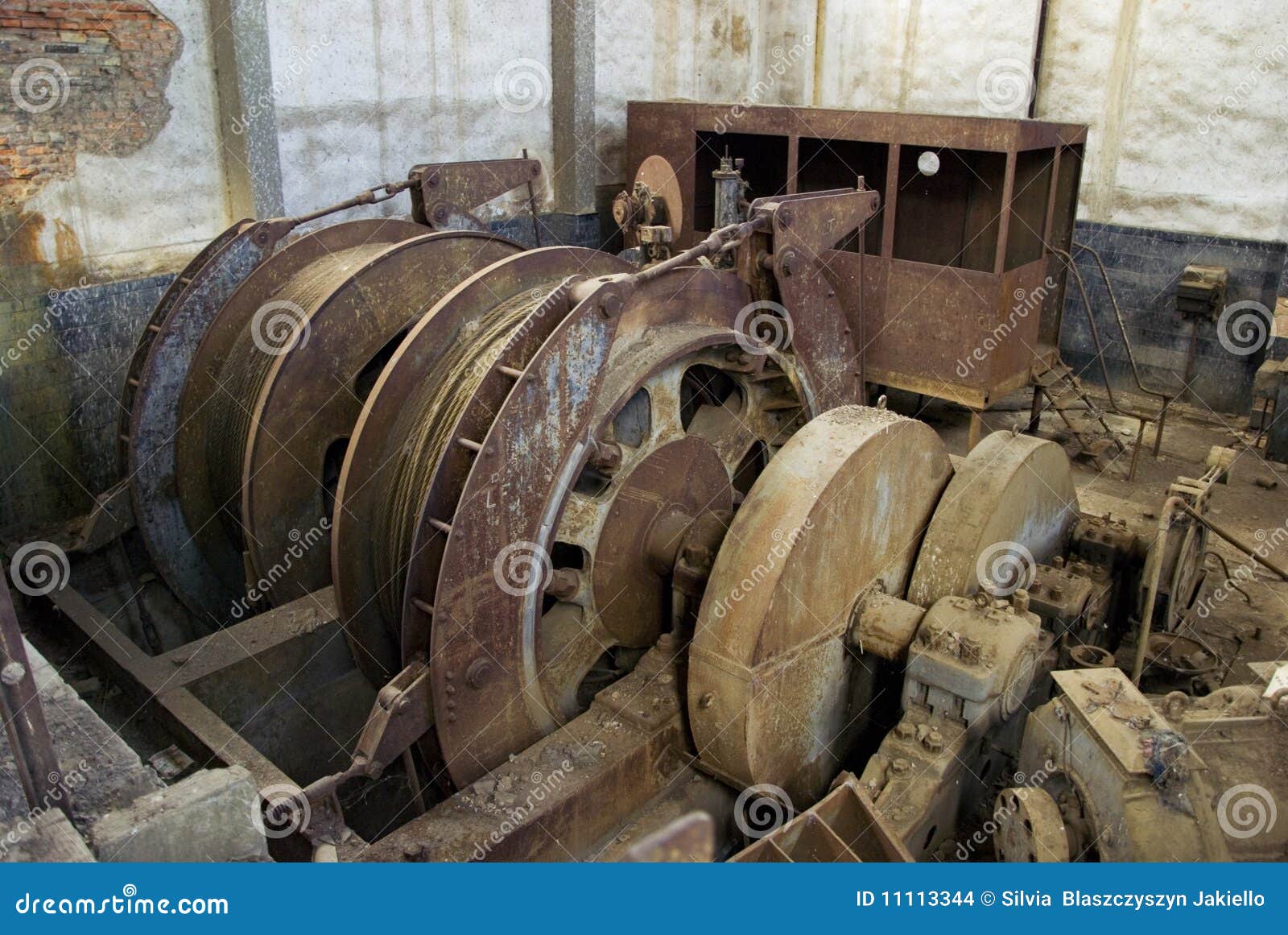 Abandoned big pulley mine. stock photo. Image of mechanics - 11113344