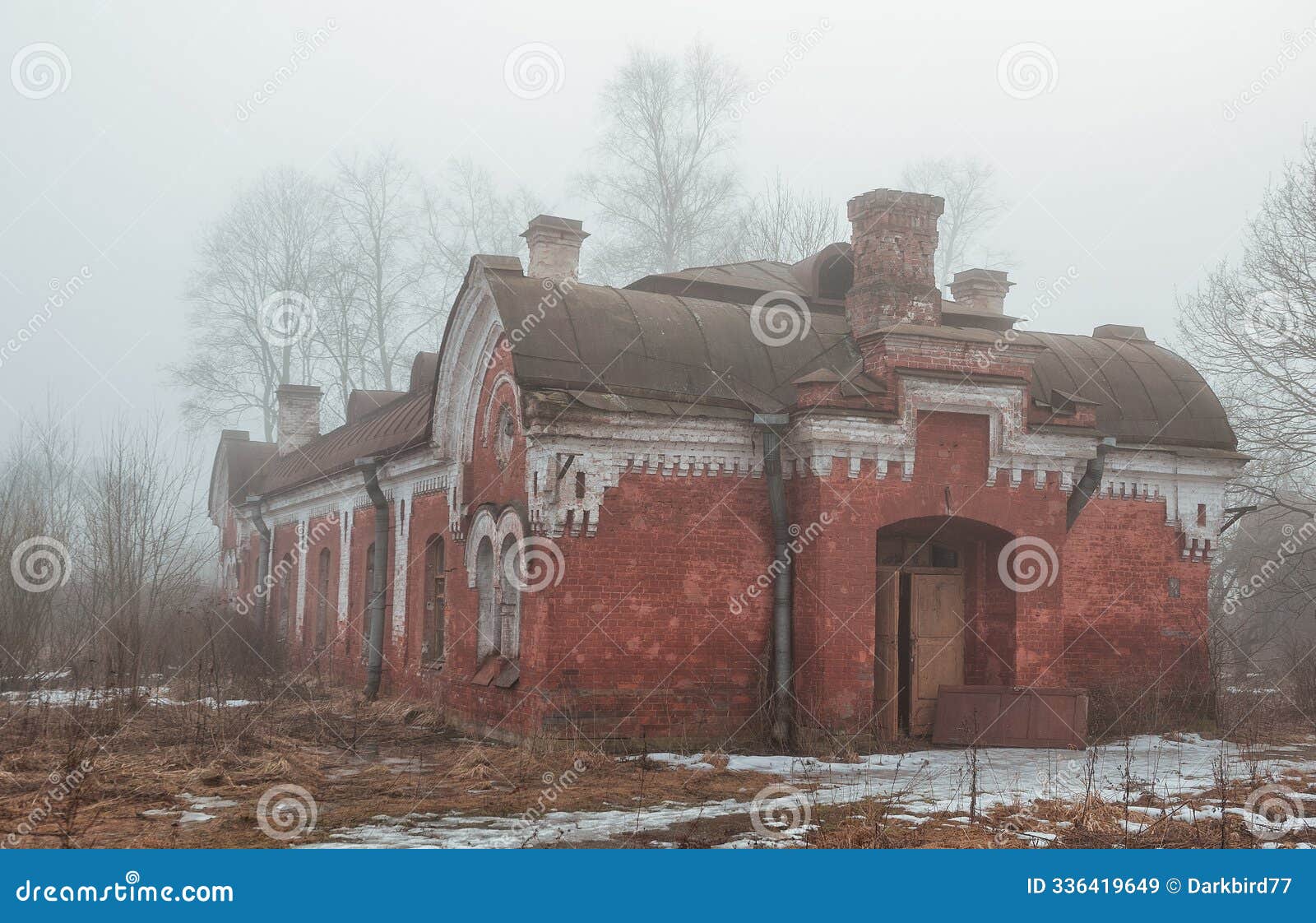 Abandoned Brick House with a Decayed Wall and Broken Window in a Misty ...