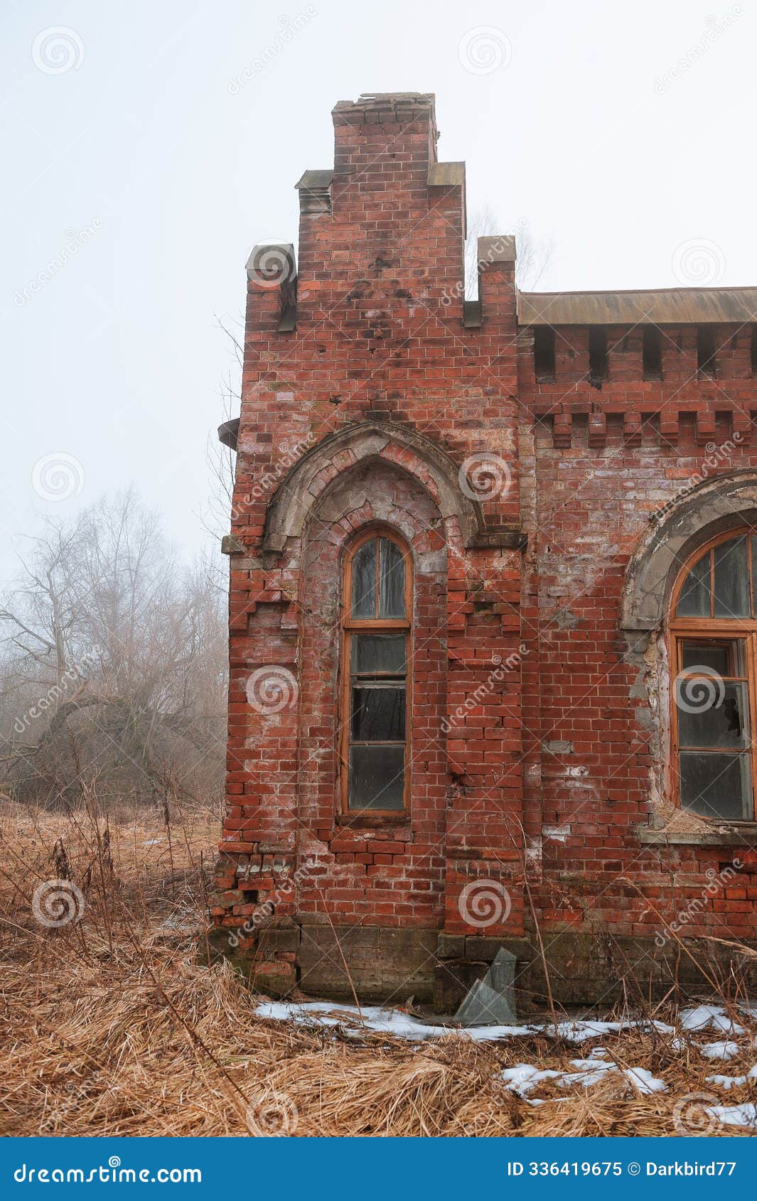 Abandoned Brick House with a Decayed Wall and Broken Window in a Misty ...