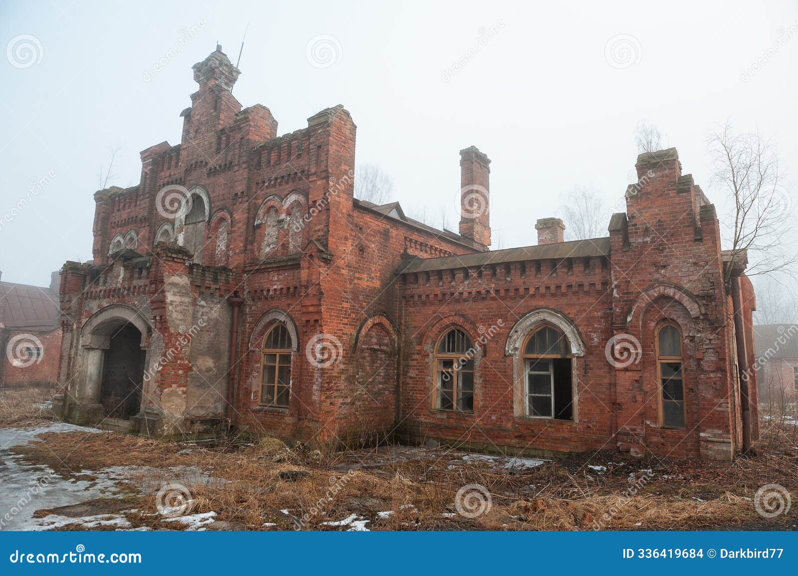 Abandoned Brick House with a Decayed Wall and Broken Window in a Misty ...