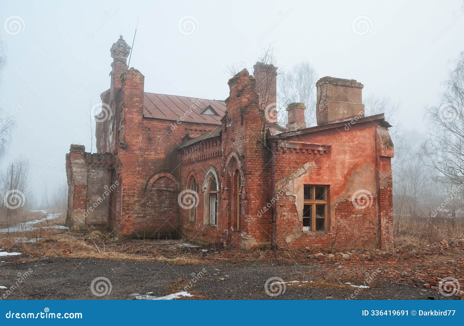Abandoned Brick House with a Decayed Wall and Broken Window in a Misty ...