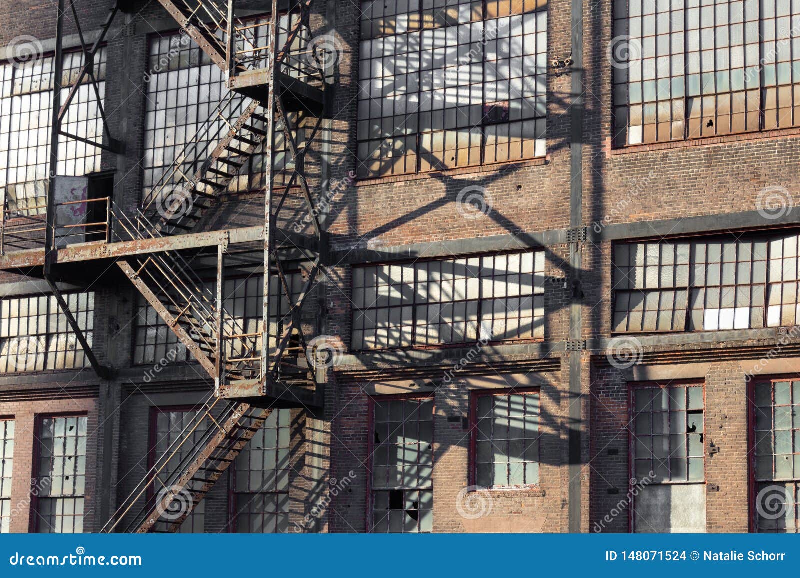 Abandoned Brick Warehouse with Broken Windows and Fire Escape Stock ...