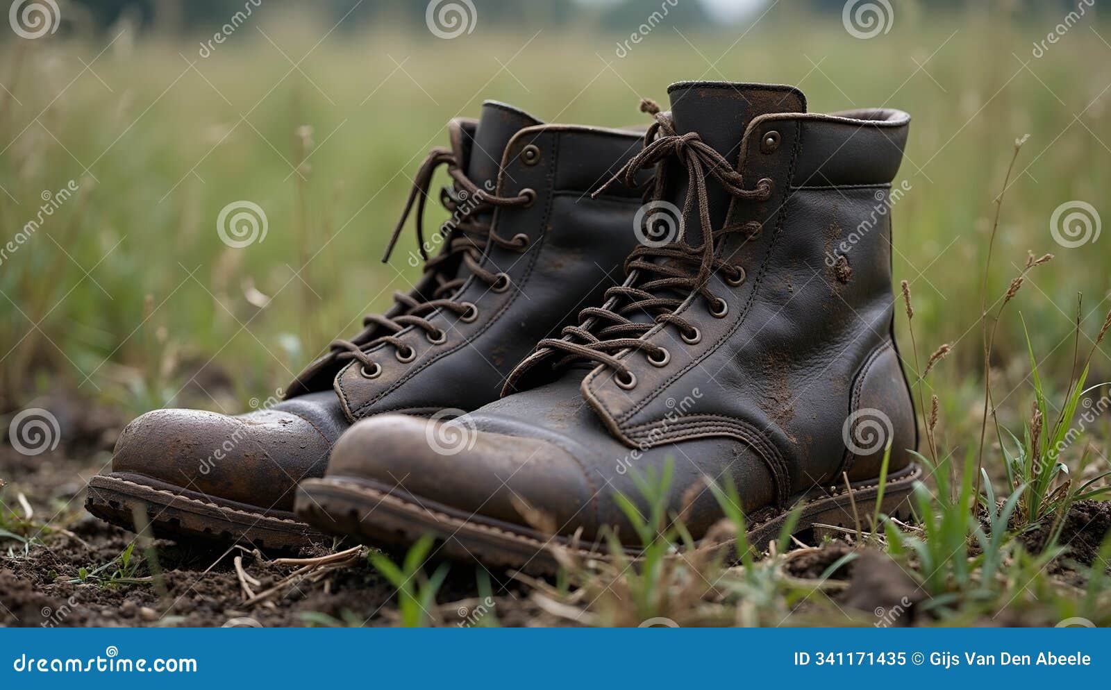 Abandoned Broken Military Boots Covered in Mud in a Field Stock ...