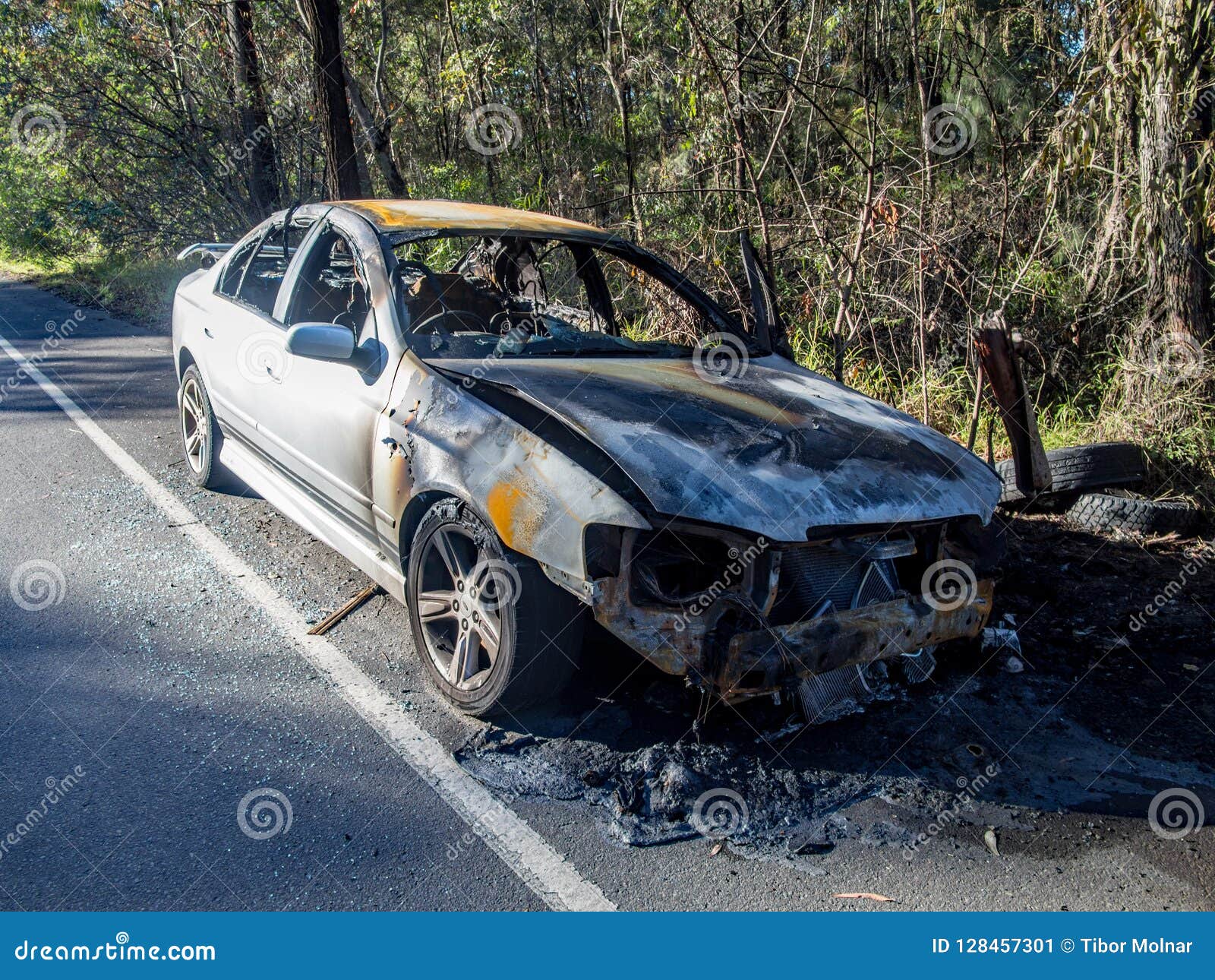 Abandoned Burnt Out Car at the Road Side Front Image Stock Image ...