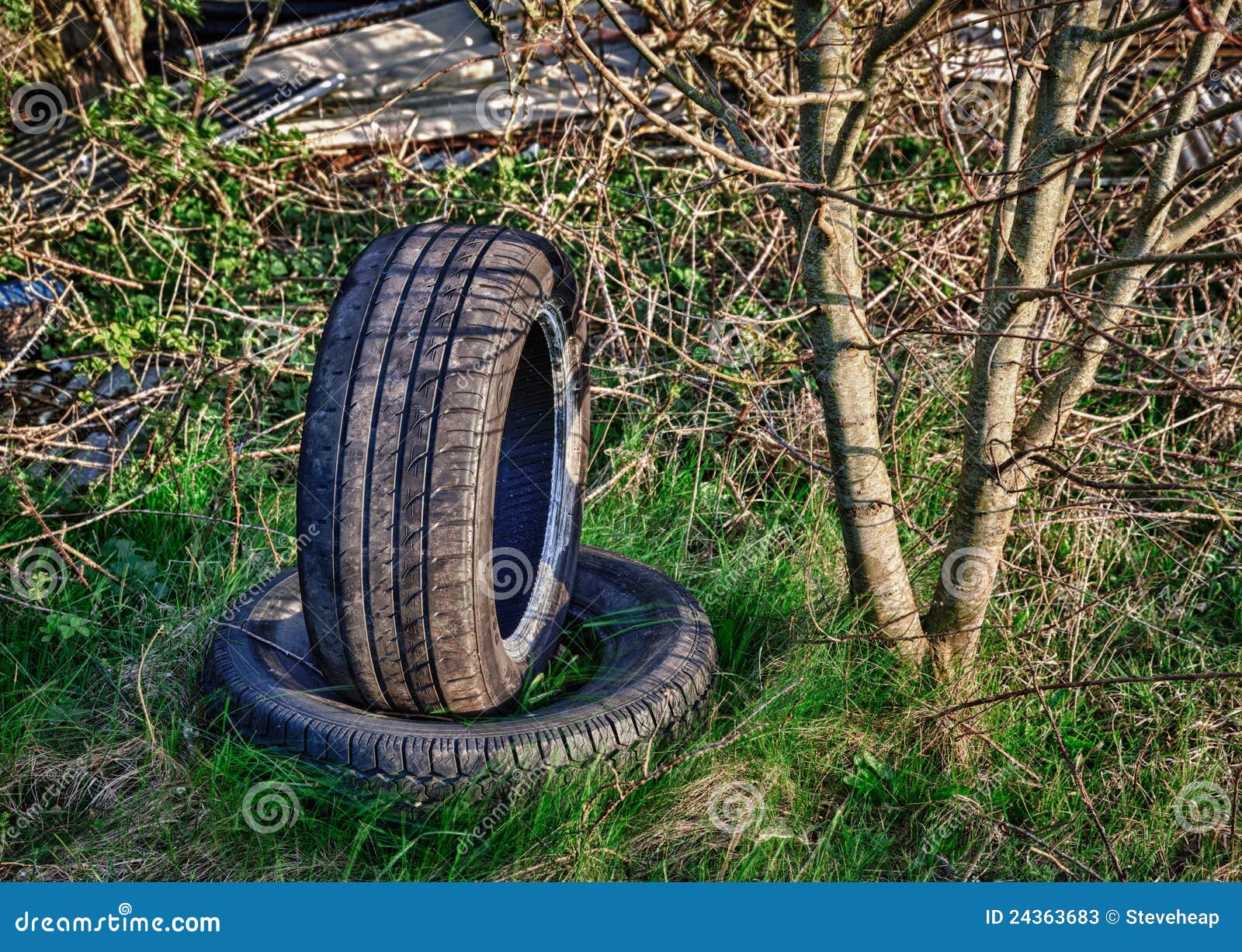 Dumped Car Tyres. Fly-tipping Old Tyre Waste And Rubber Recycling ...