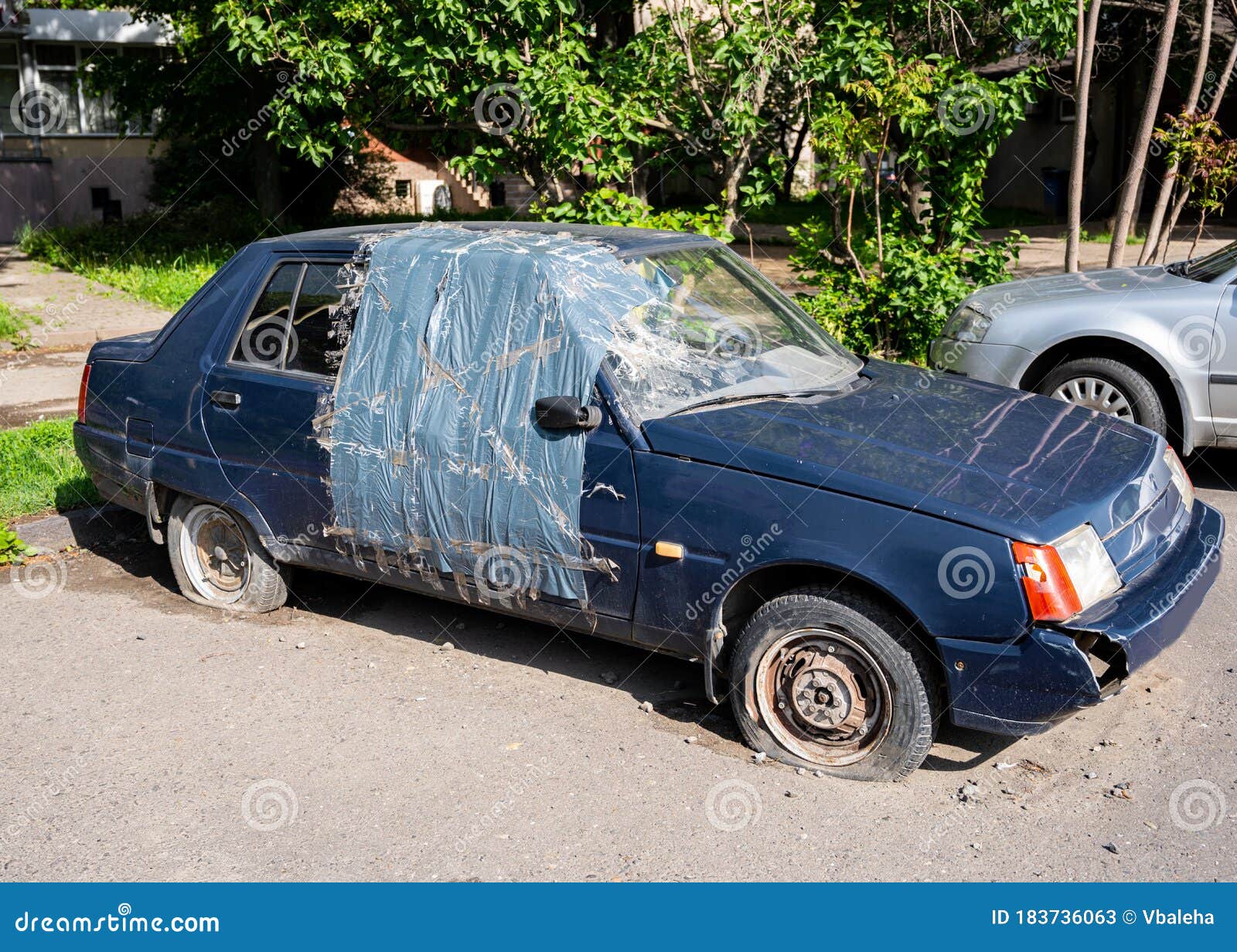 A Damaged Broken Useless Car Standing Road Side As A Scrap Editorial ...