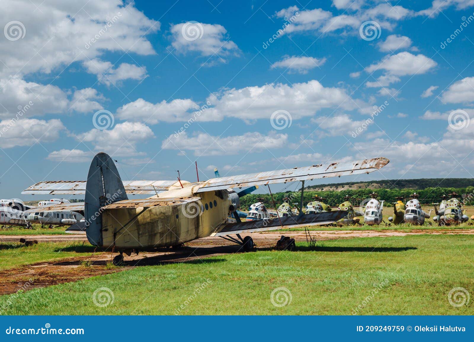 Abandoned, Destroyed, Rusty Old Plane Stand on the Grass Under a Blue ...