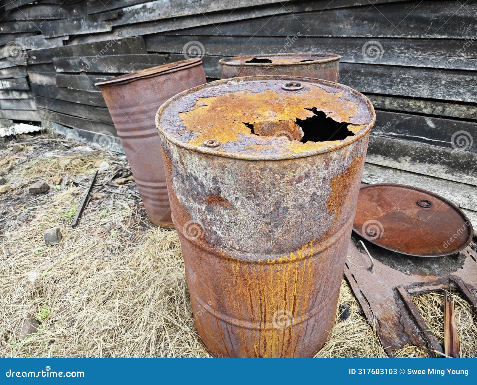 Abandoned Empty and Rusty Metal Barrel Left at the Junkyard. Stock ...