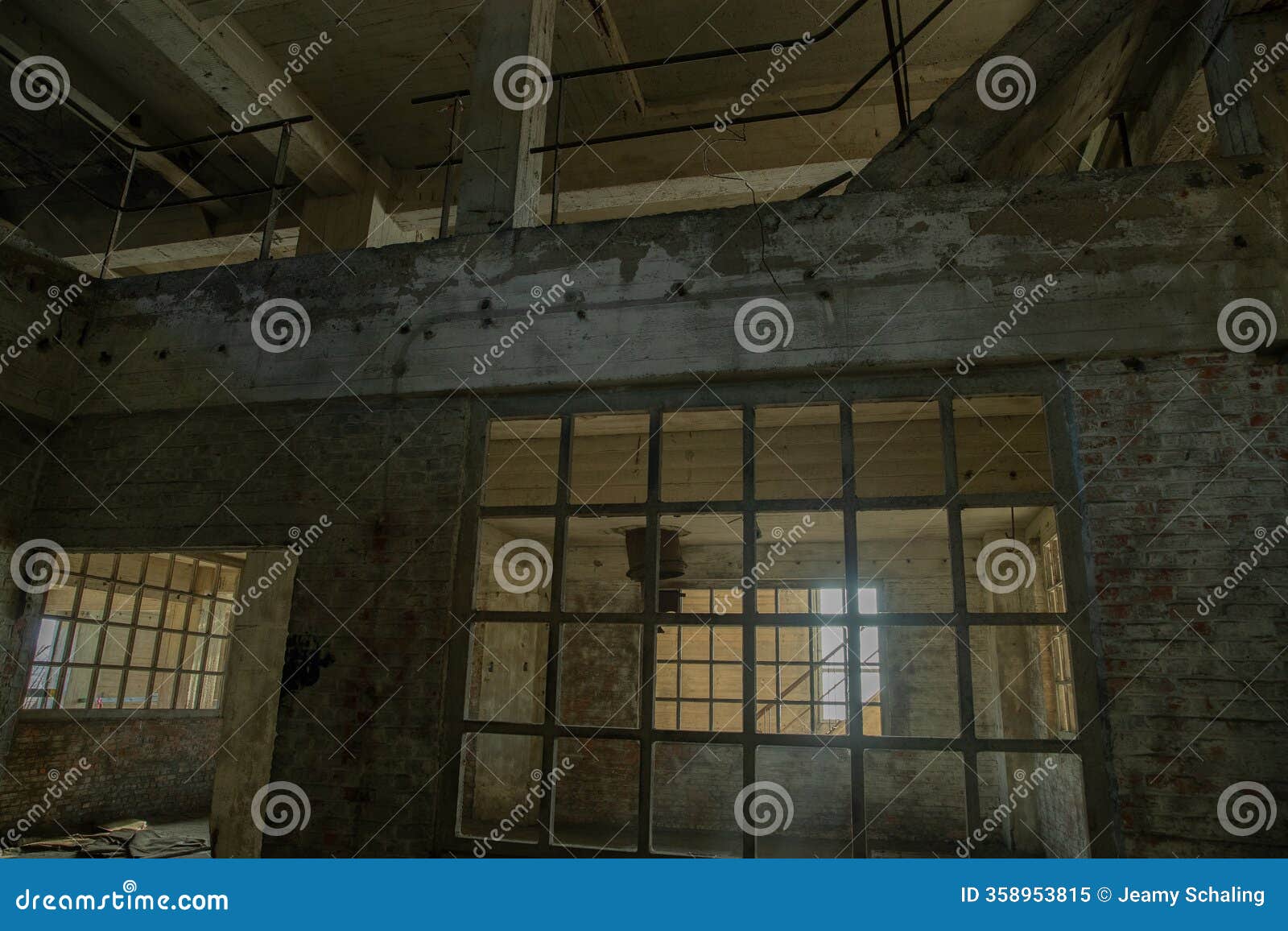Abandoned Industrial Interior with Broken Grid Windows and Exposed ...