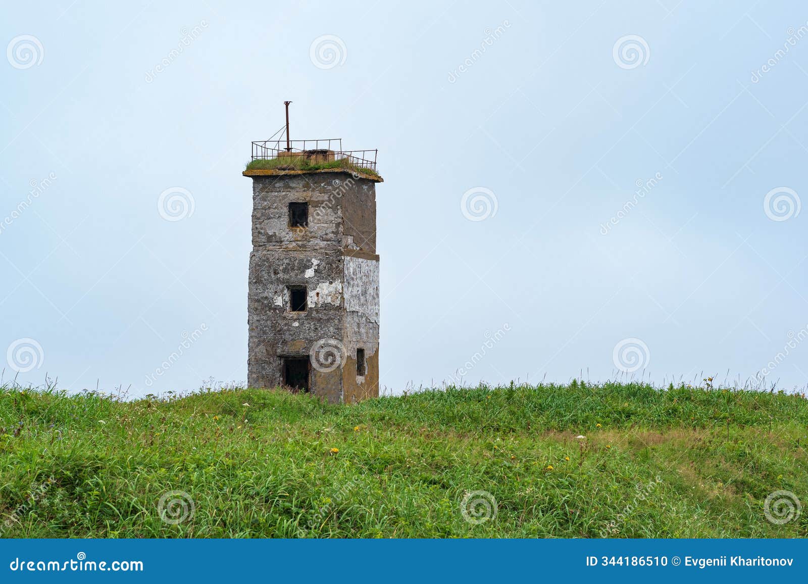 Abandoned Lighthouse on a Grassy Seashore Stock Photo - Image of ruined ...
