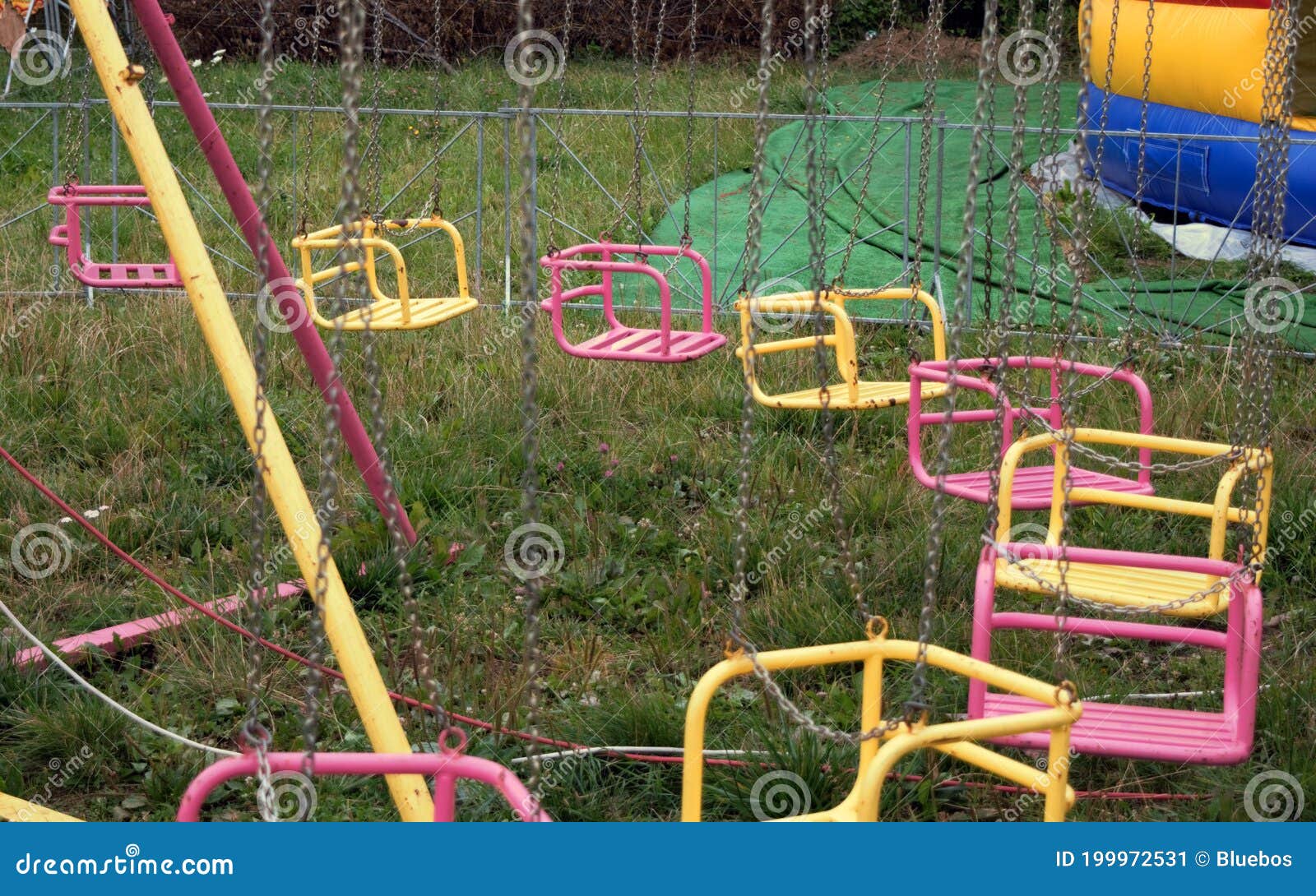 Abandoned Merry-go-round With Seats Of Different Colors On Chains Stock ...