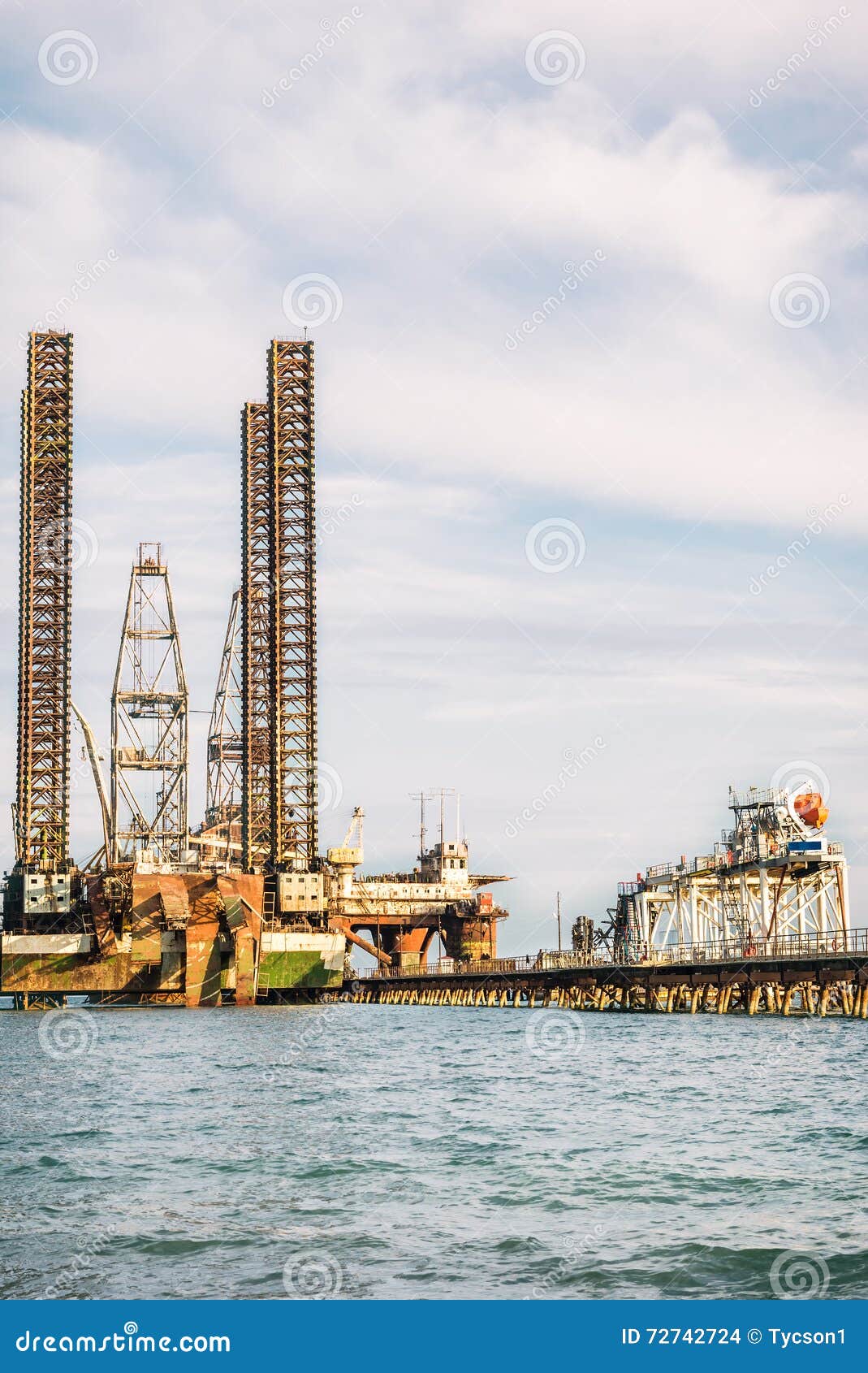 Abandoned oil rigs stock photo. Image of rust, green - 72742724