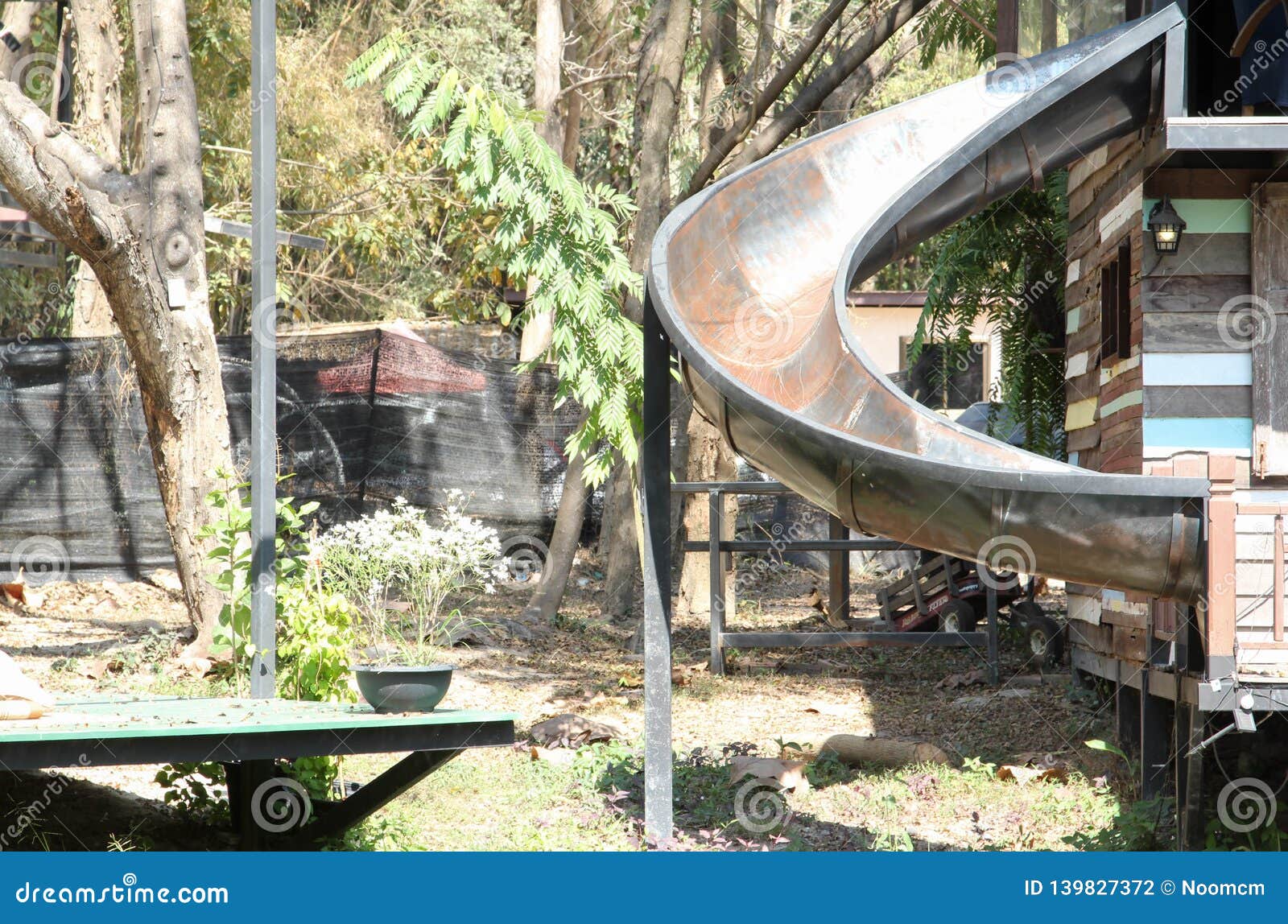 Water slide in the park stock photo. Image of retro - 139827372