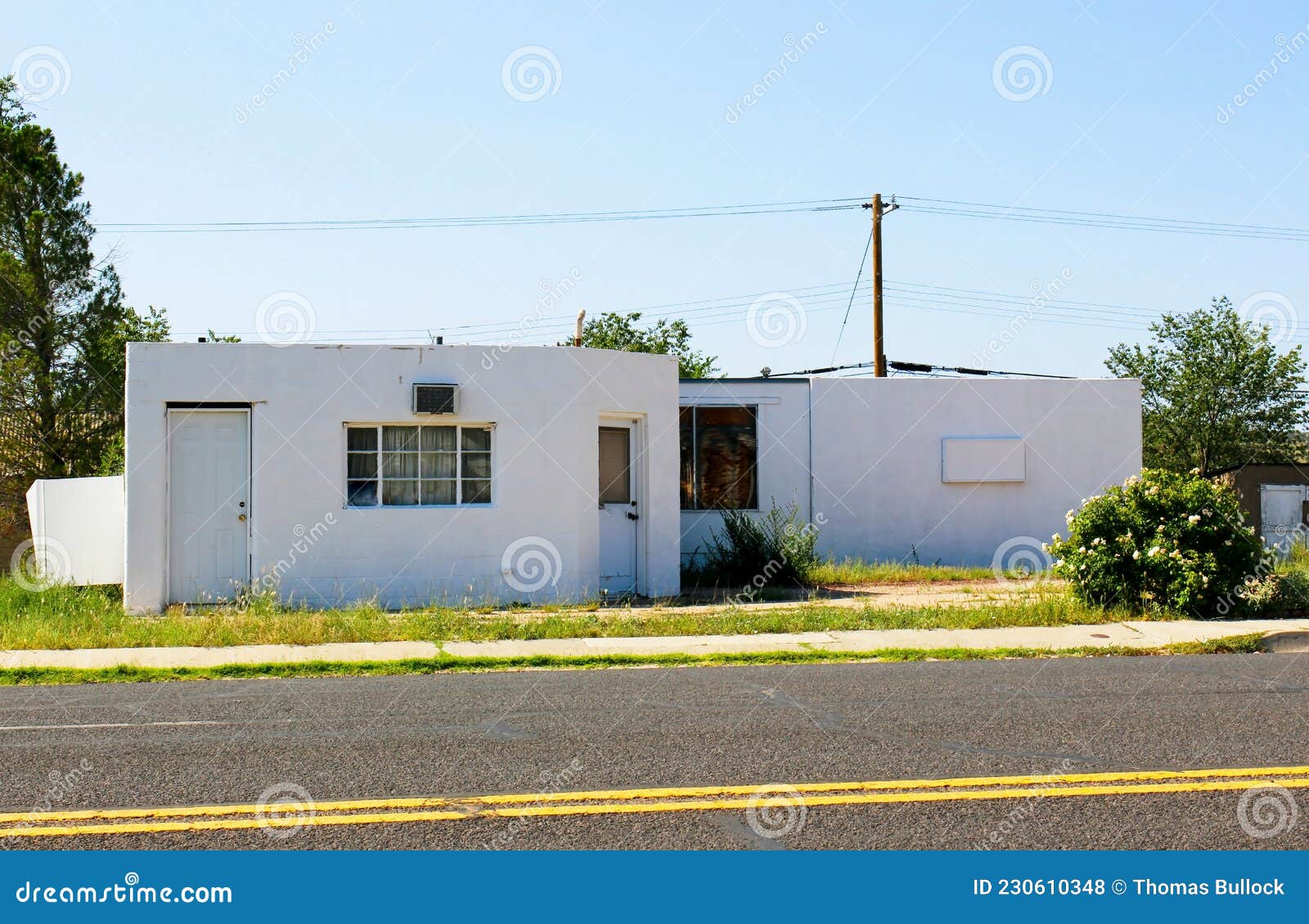 Old Abandoned One Level Building With Blocked Out Windows Royalty-Free ...