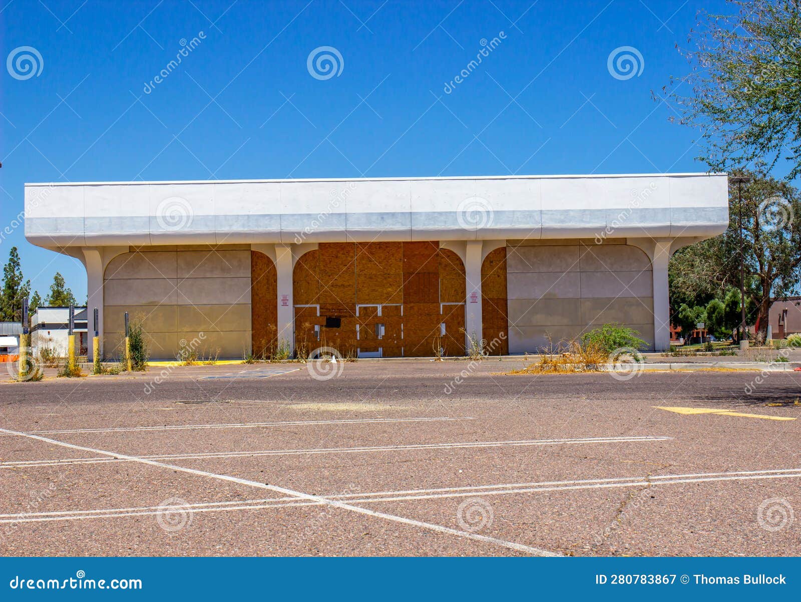 Abandoned One Story Commercial Storefront with Boarded Up Doors Stock ...