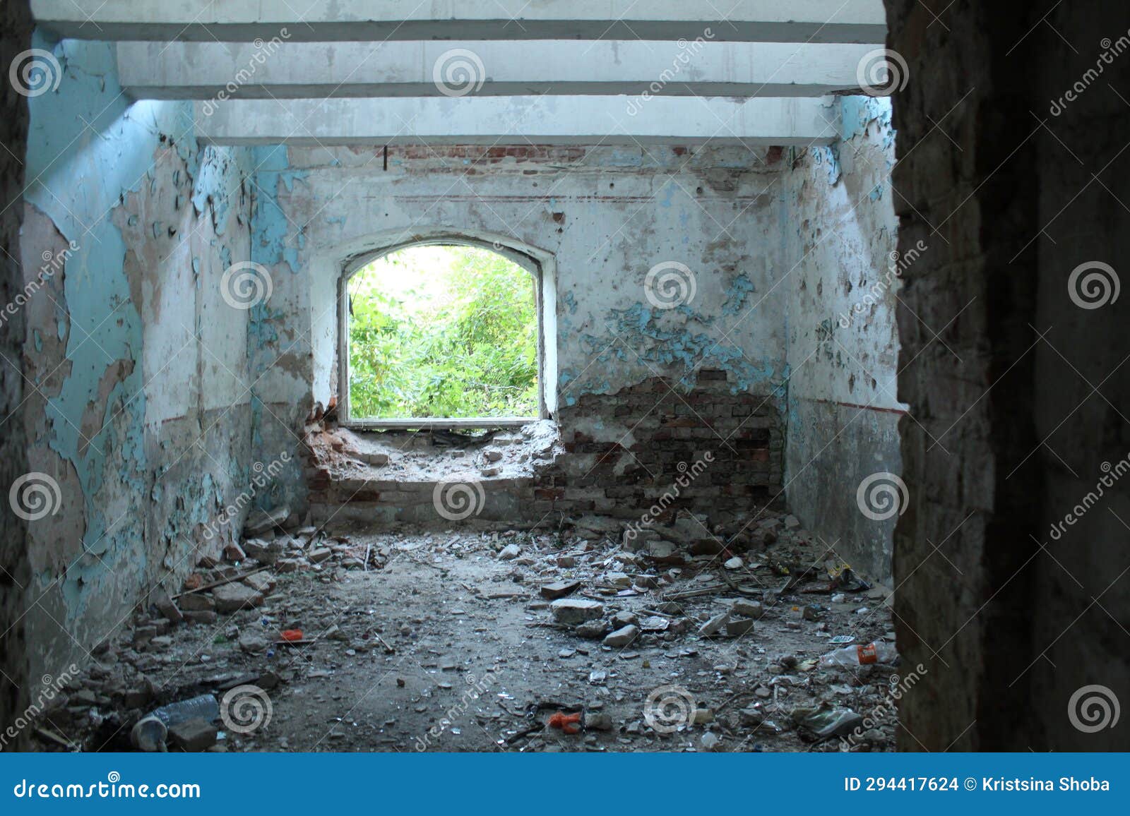 An Abandoned Ruined Room with Fragments of a Wall of Bricks. the ...