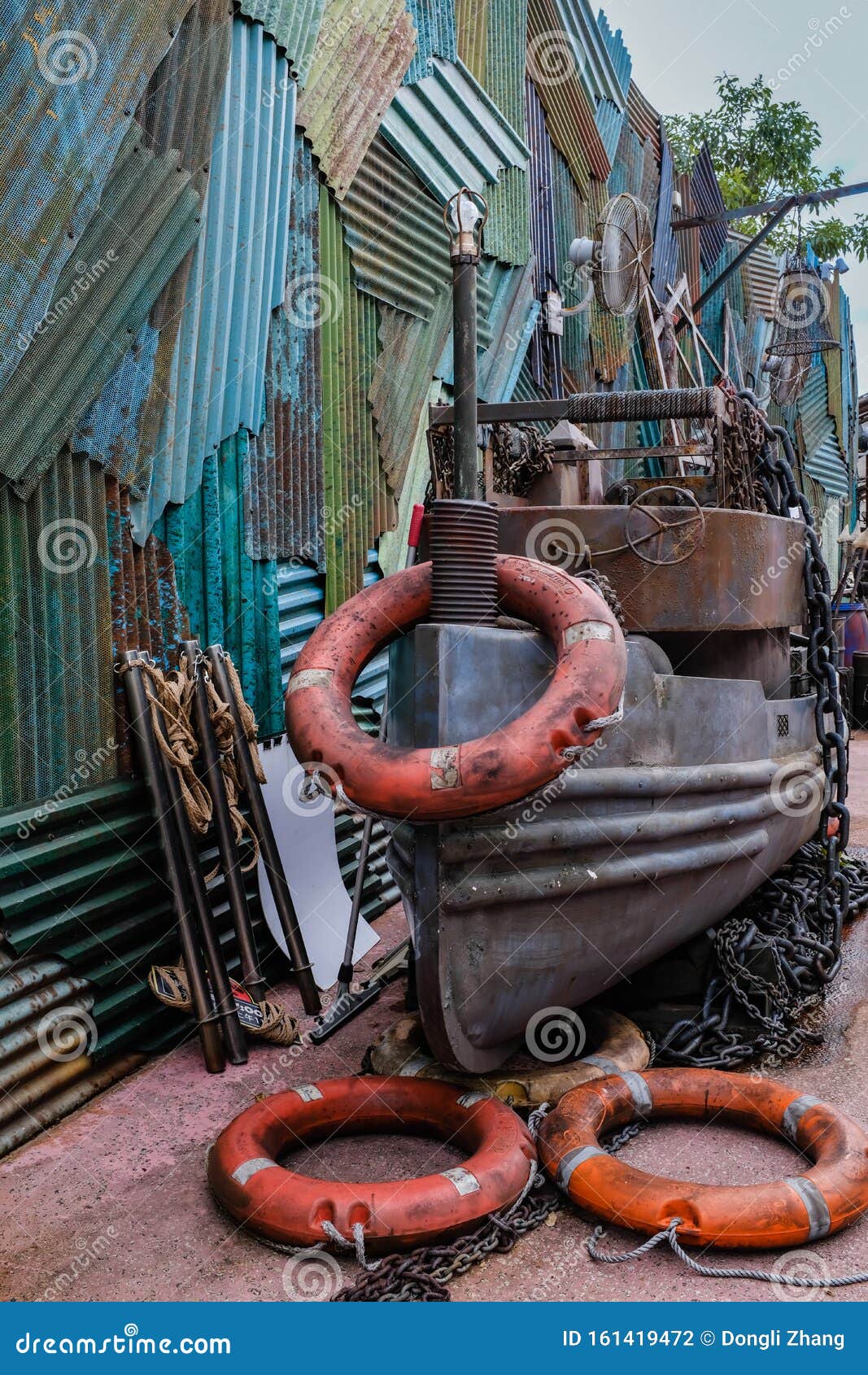 Abandoned Rusty Metal Ship Parked in Front of Vintage Wall Stock Photo ...