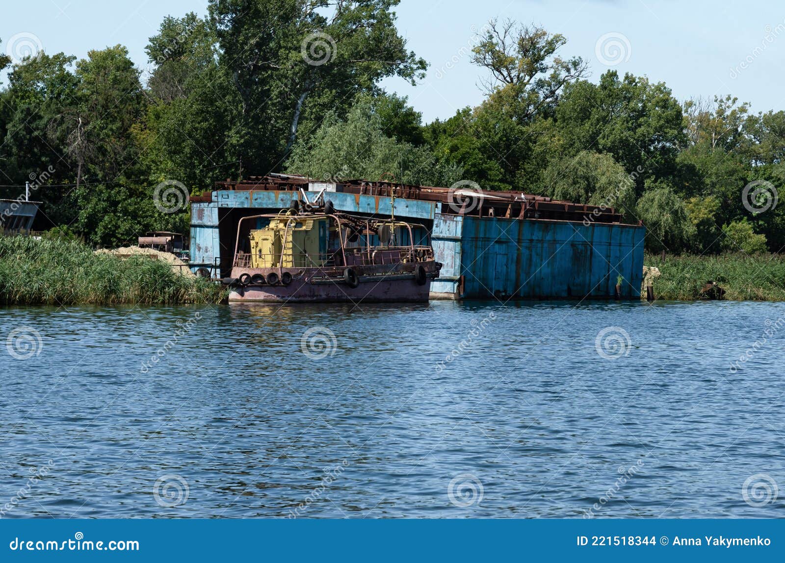 Abandoned Rusty Ship on the River Bank. Destroyed Boat and Pier Stock ...