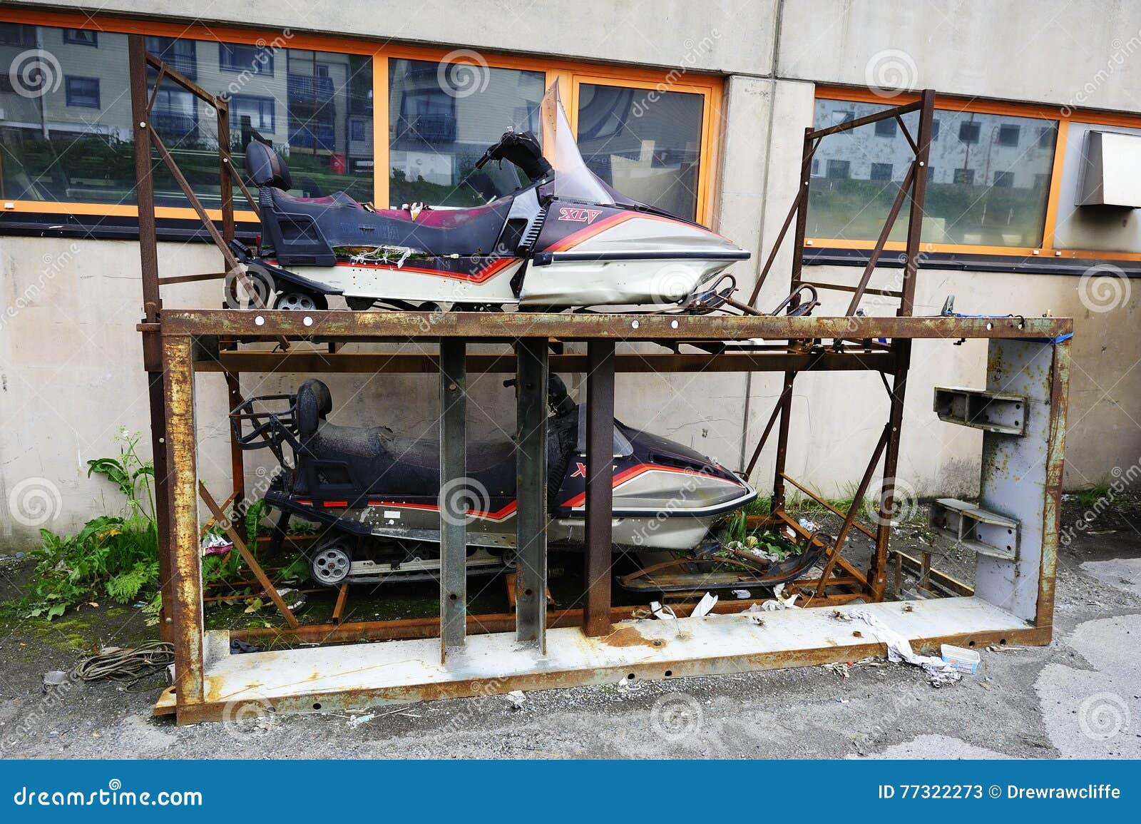 Abandoned snowmobiles editorial stock photo. Image of pavement - 77322273