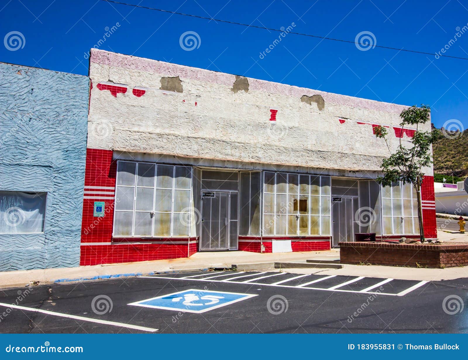 Abandoned Store Front Building with Wire Mesh Over Windows Stock Image ...