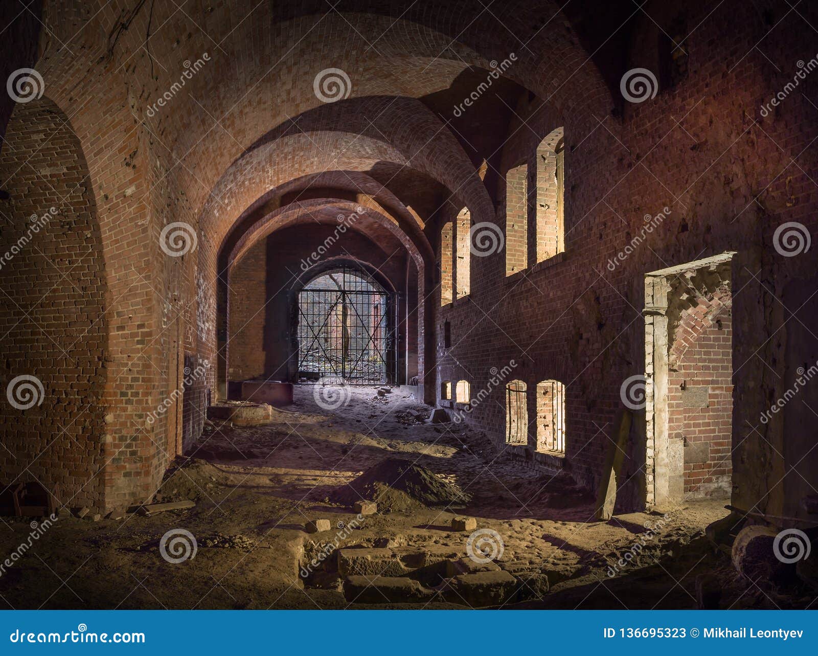 Abandoned Underground Brick Corridor with Windows Illuminated by ...