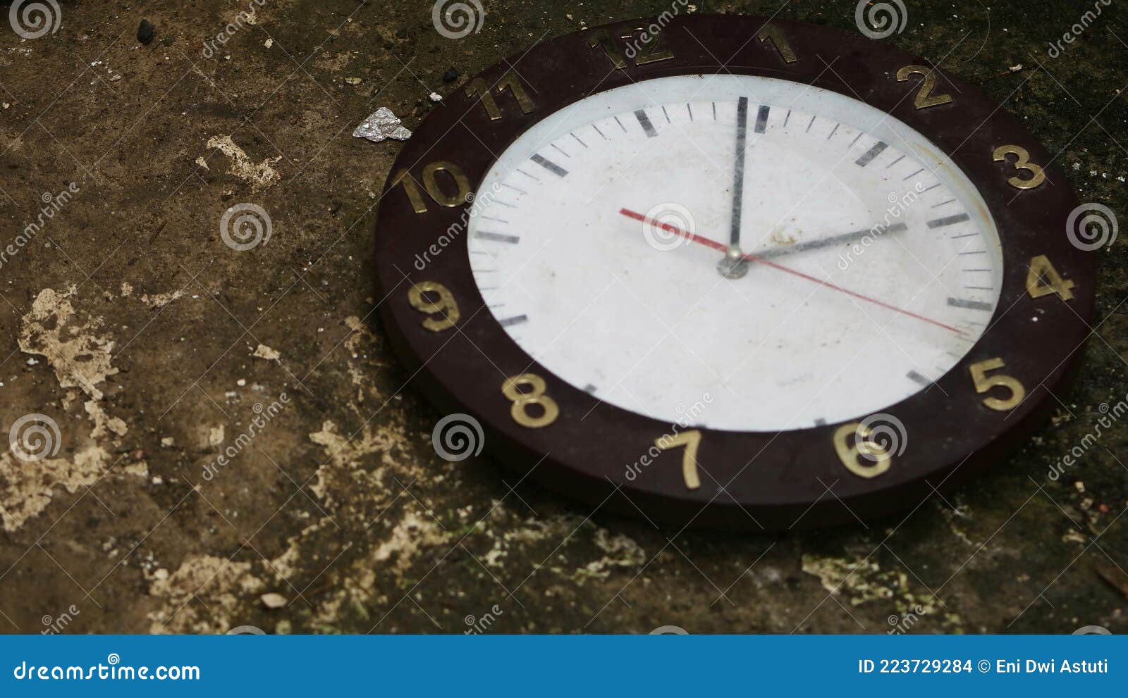 An Abandoned Wall Clock on Dirty Floor.shows 3 O& X27;clock 5 Minutes ...