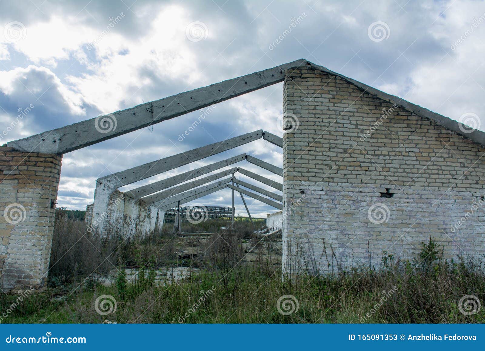 An Abandoned White Brick Building with a Triangular Roof Stock Image ...