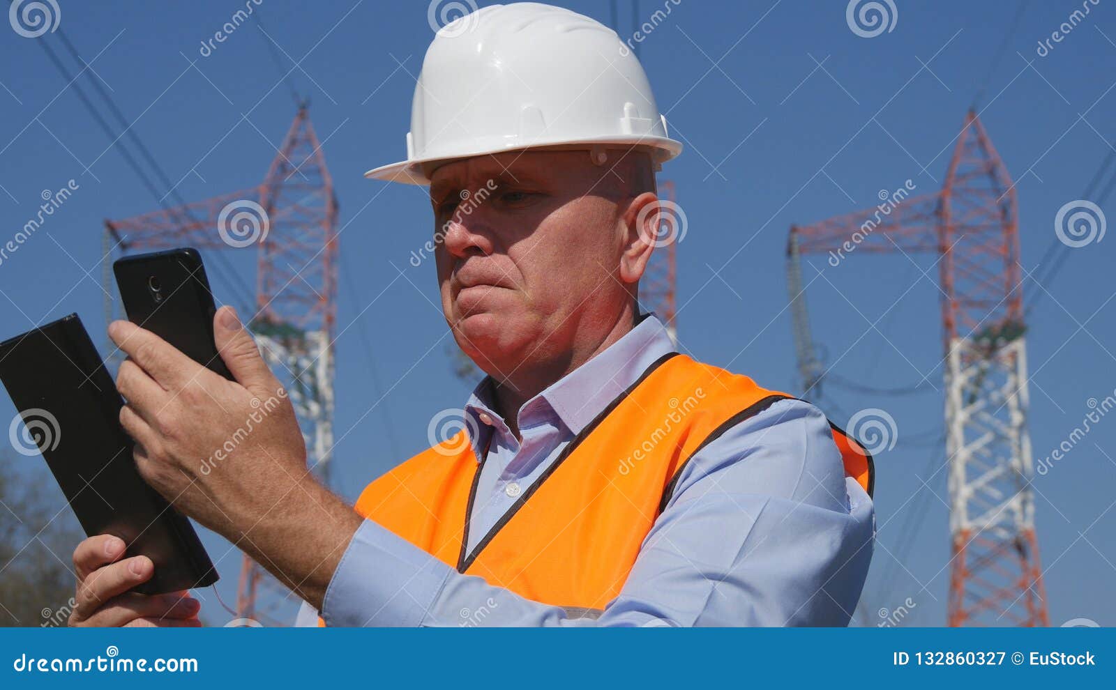 Engineer Working in Maintenance Using Cell Phone Communication. Stock ...