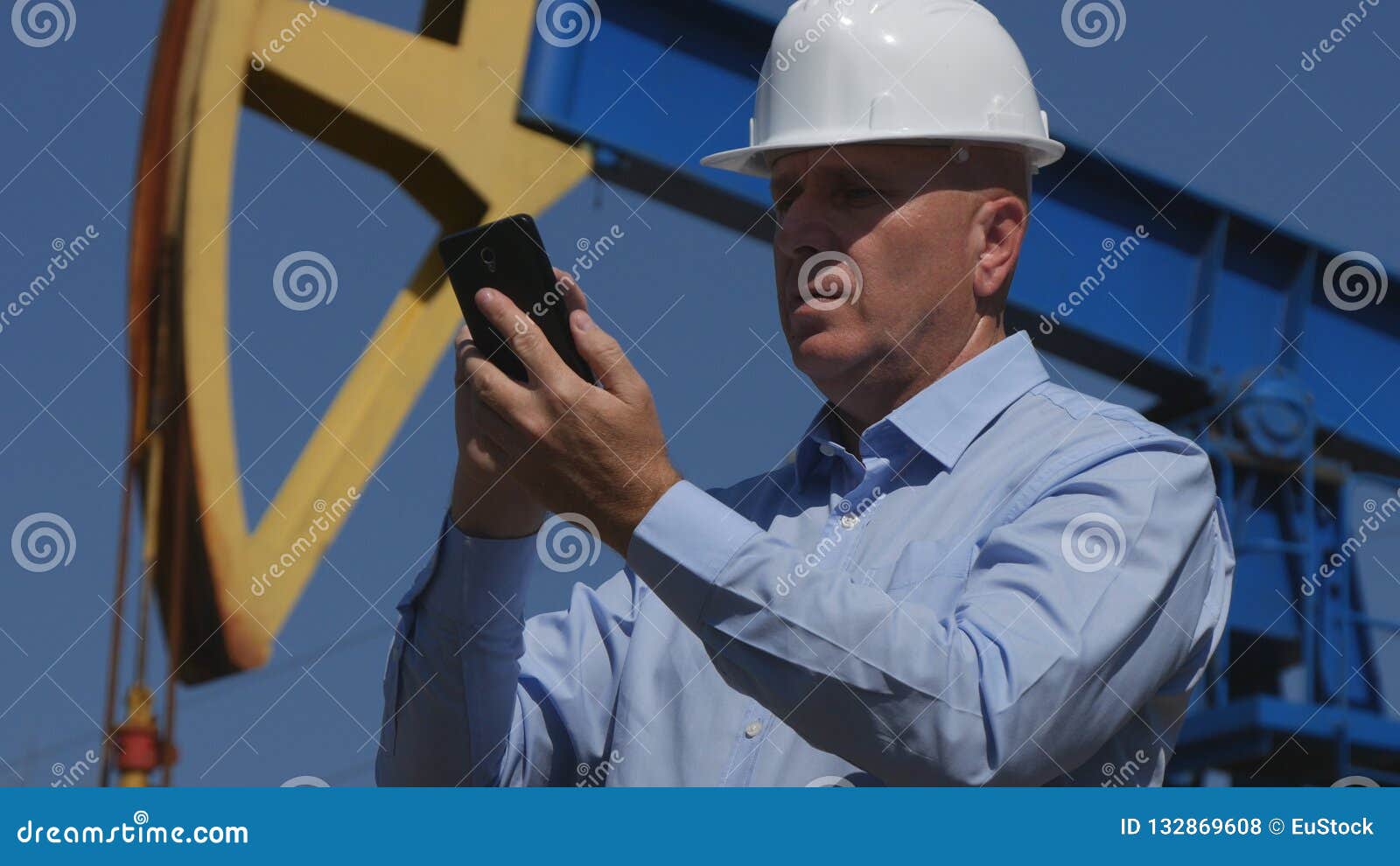 Petroleum Engineer Working in Extracting Oil Industry Text Using Mobile ...