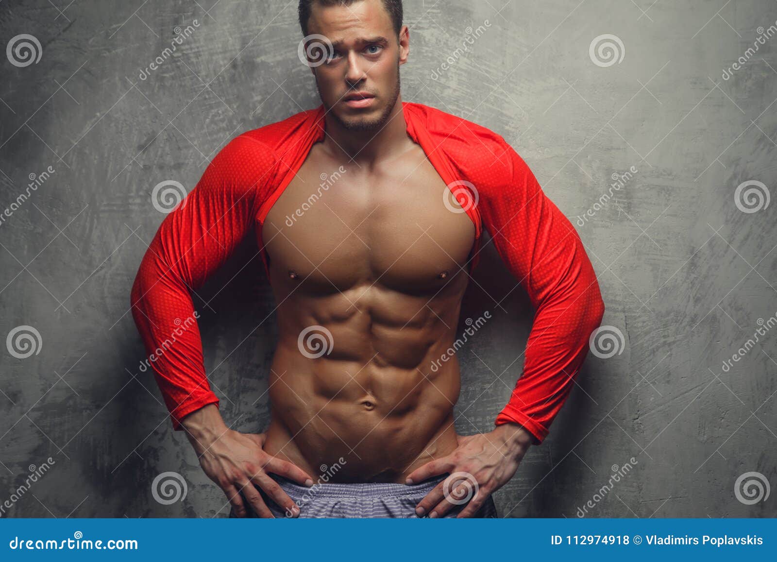 Abdominal Bodybuilder Model in a Red Jersey. Stock Photo - Image of ...