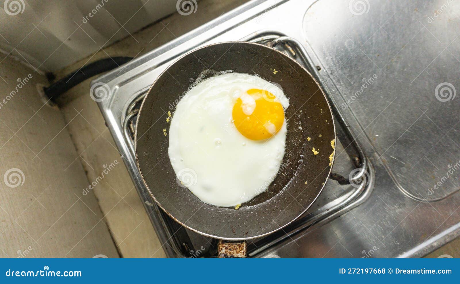 A sunny side on the pan. stock photo. Image of fried - 272197668