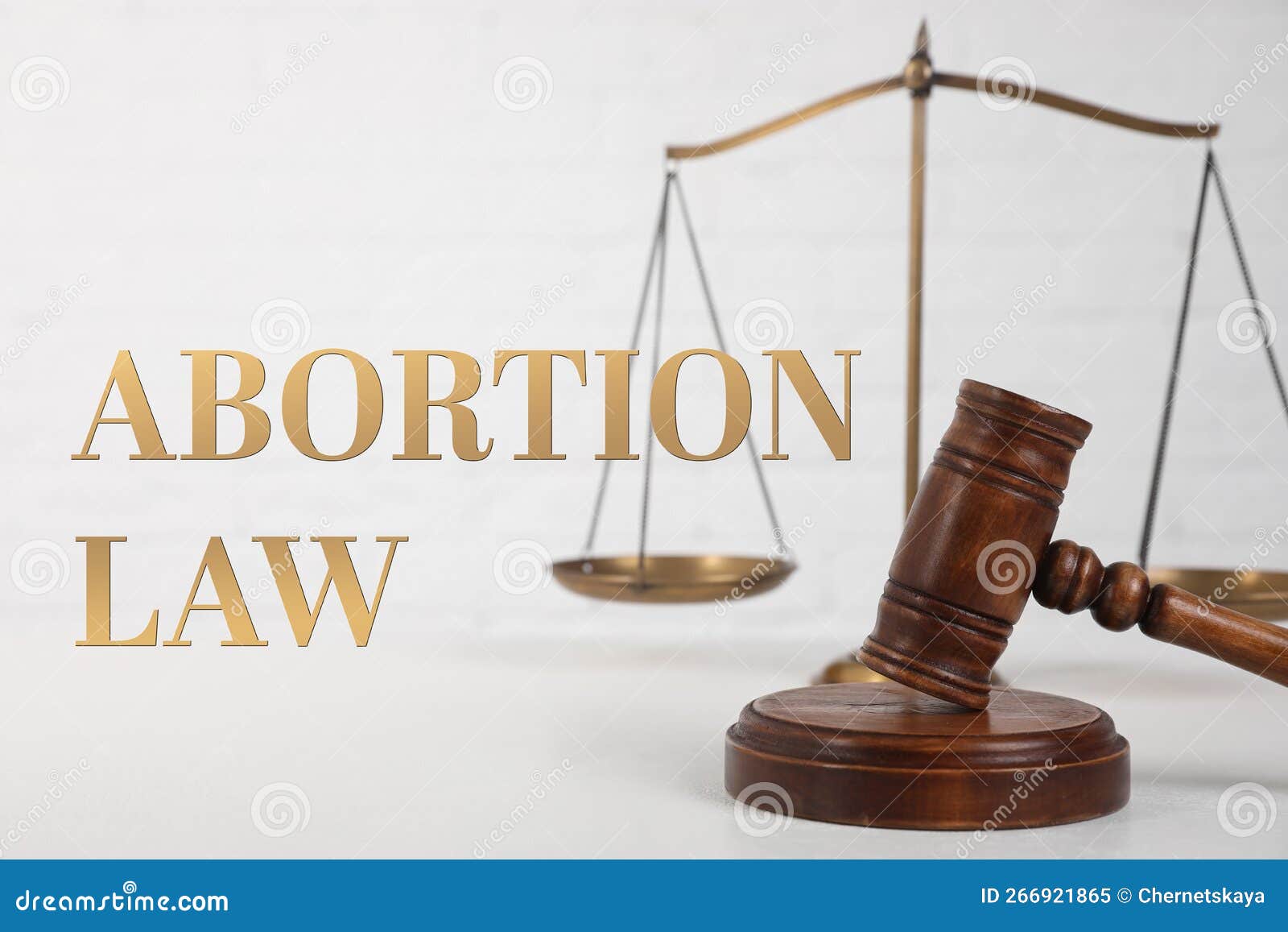 Abortion Law. Gavel and Scales of Justice on Table Against White ...